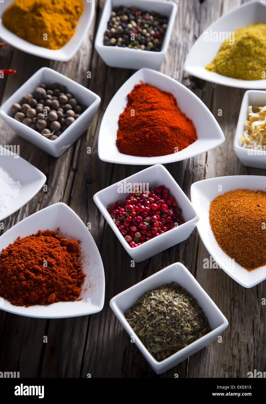 Assorted spices on wooden background Stock Photo - Alamy