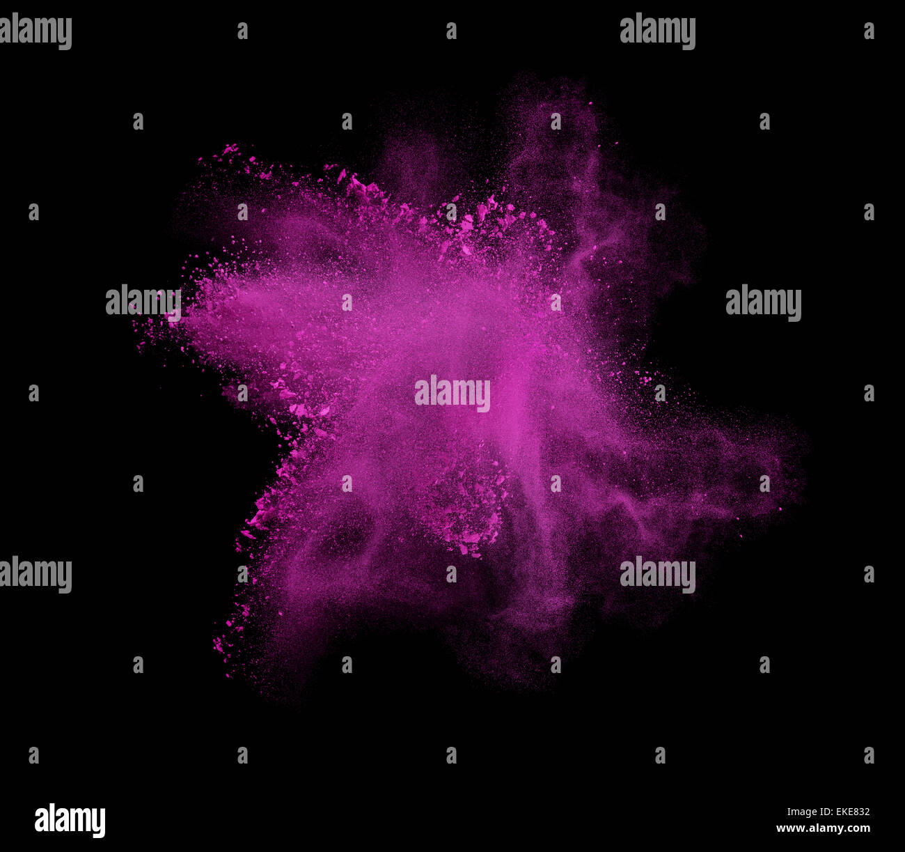 Freeze motion of pink powder exploding, isolated on black. Abstract ...
