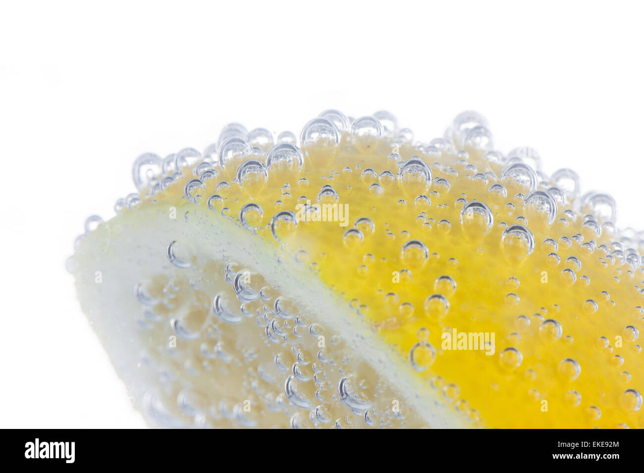 Fresh lemon in water with bubbles Stock Photo - Alamy