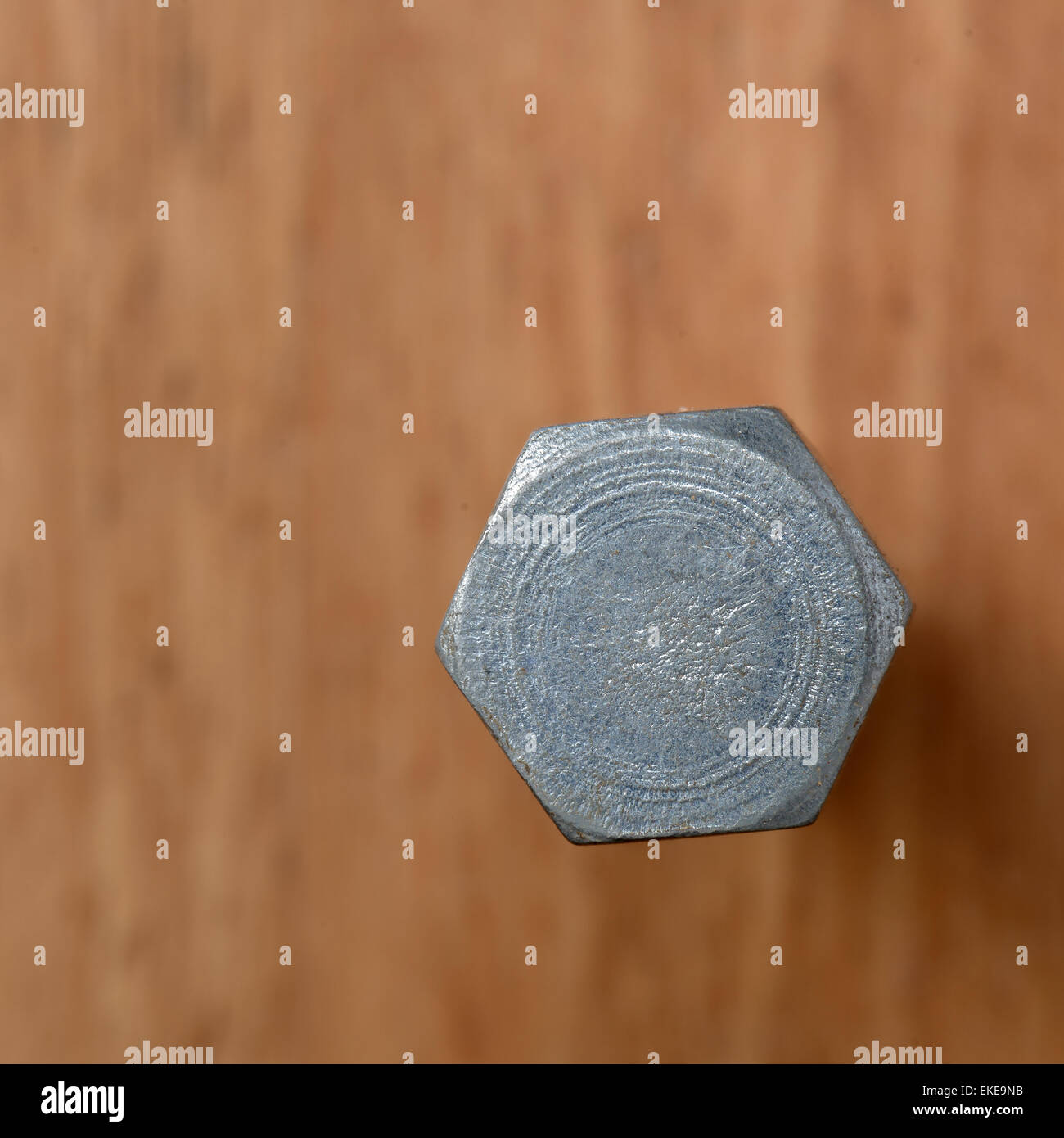 One bolt on wood blur background Stock Photo - Alamy