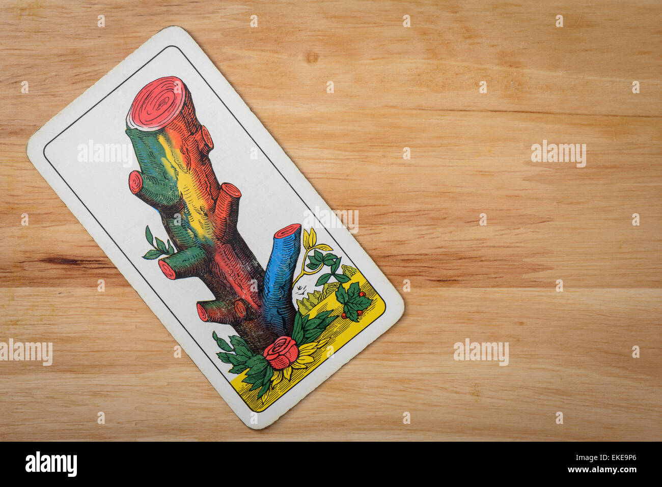 Wood ace italian card on a wood background Stock Photo - Alamy