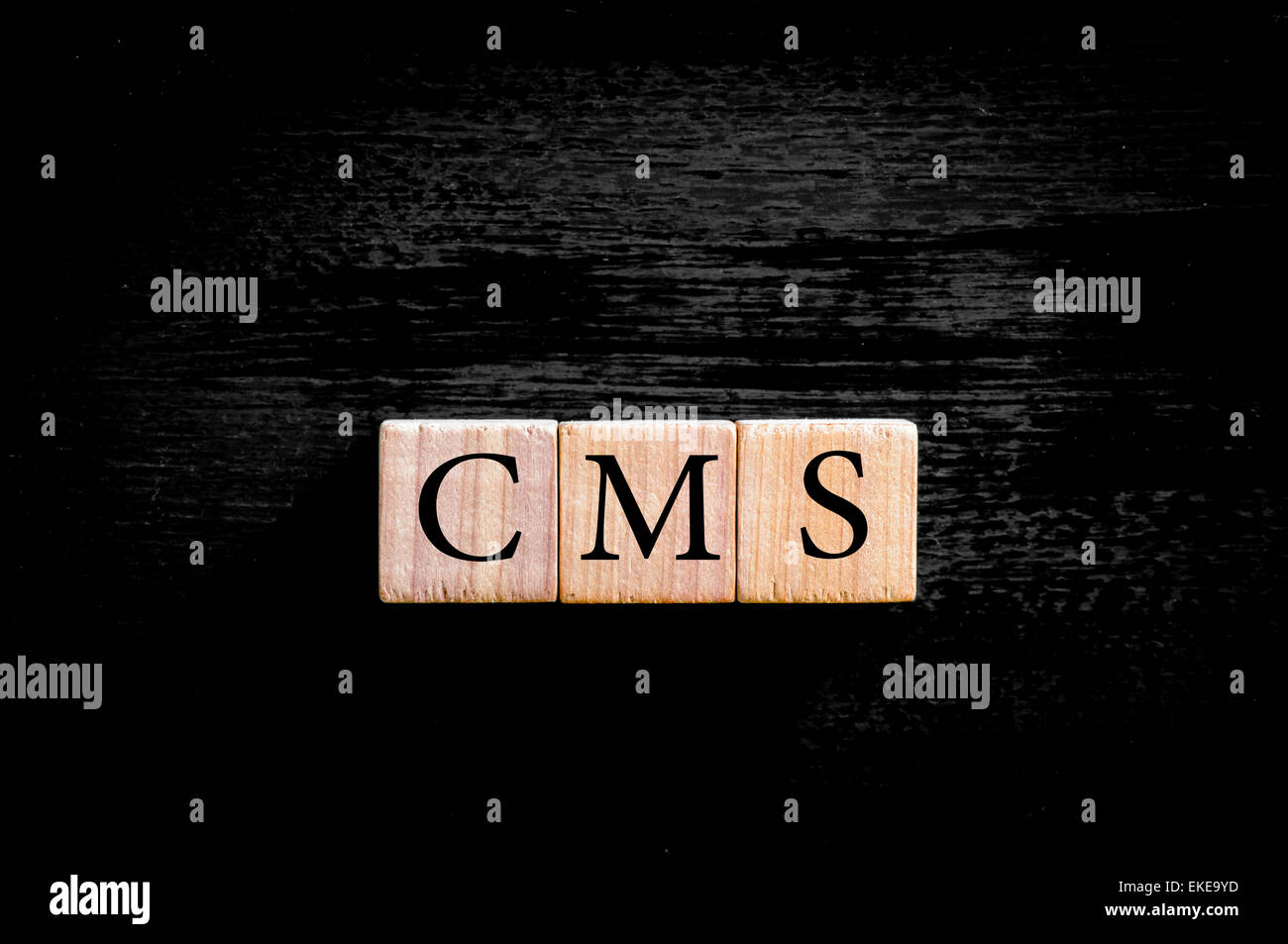 Acronym CMS - content management system. Wooden small cubes with ...