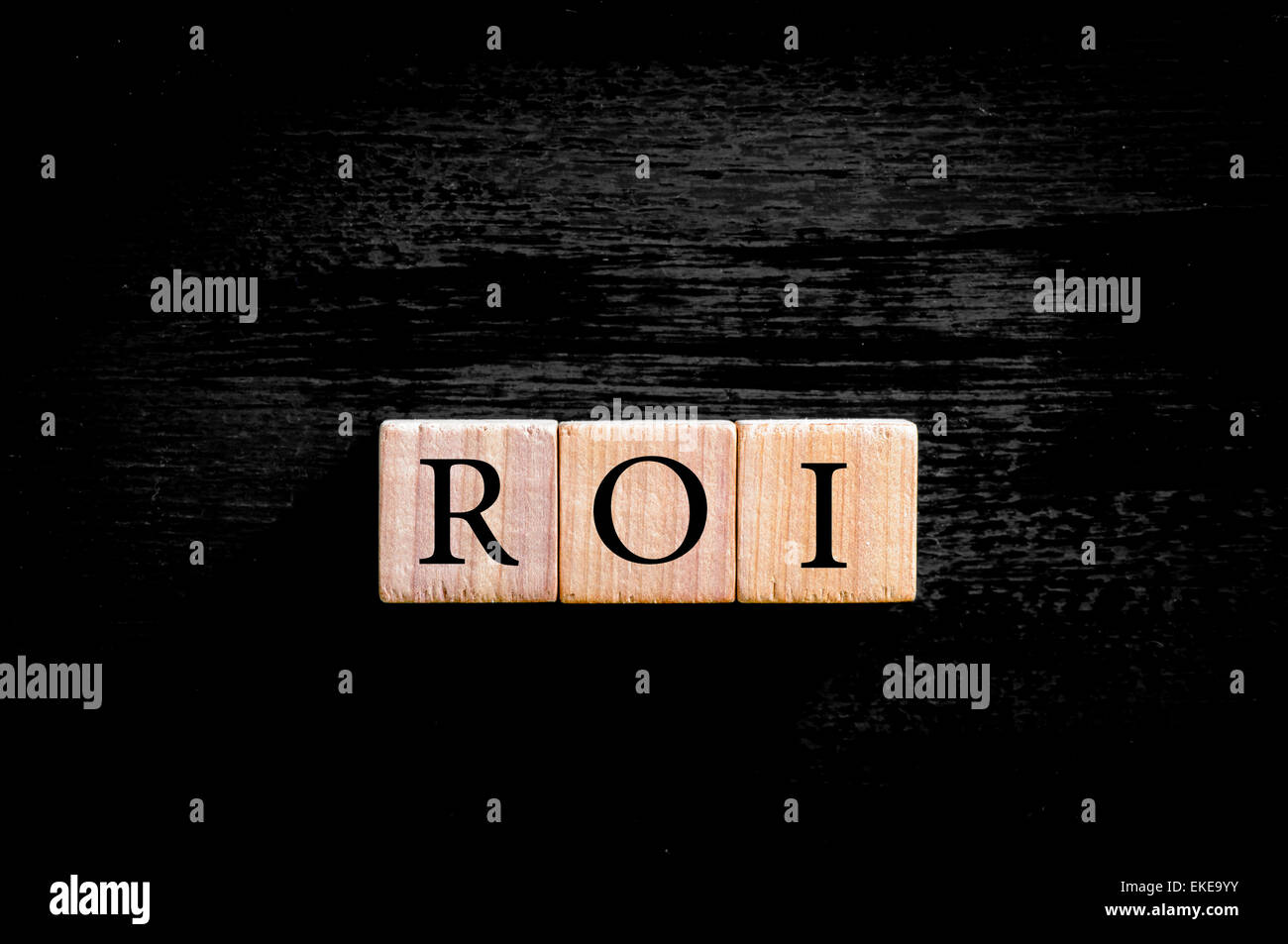 Acronym ROI - Return on Investment. Wooden small cubes with letters ...
