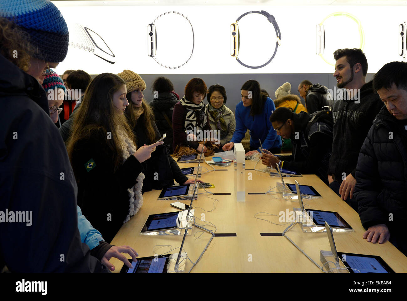New York, USA. 9th Apr, 2015. Customers test Apple products at Apple ...