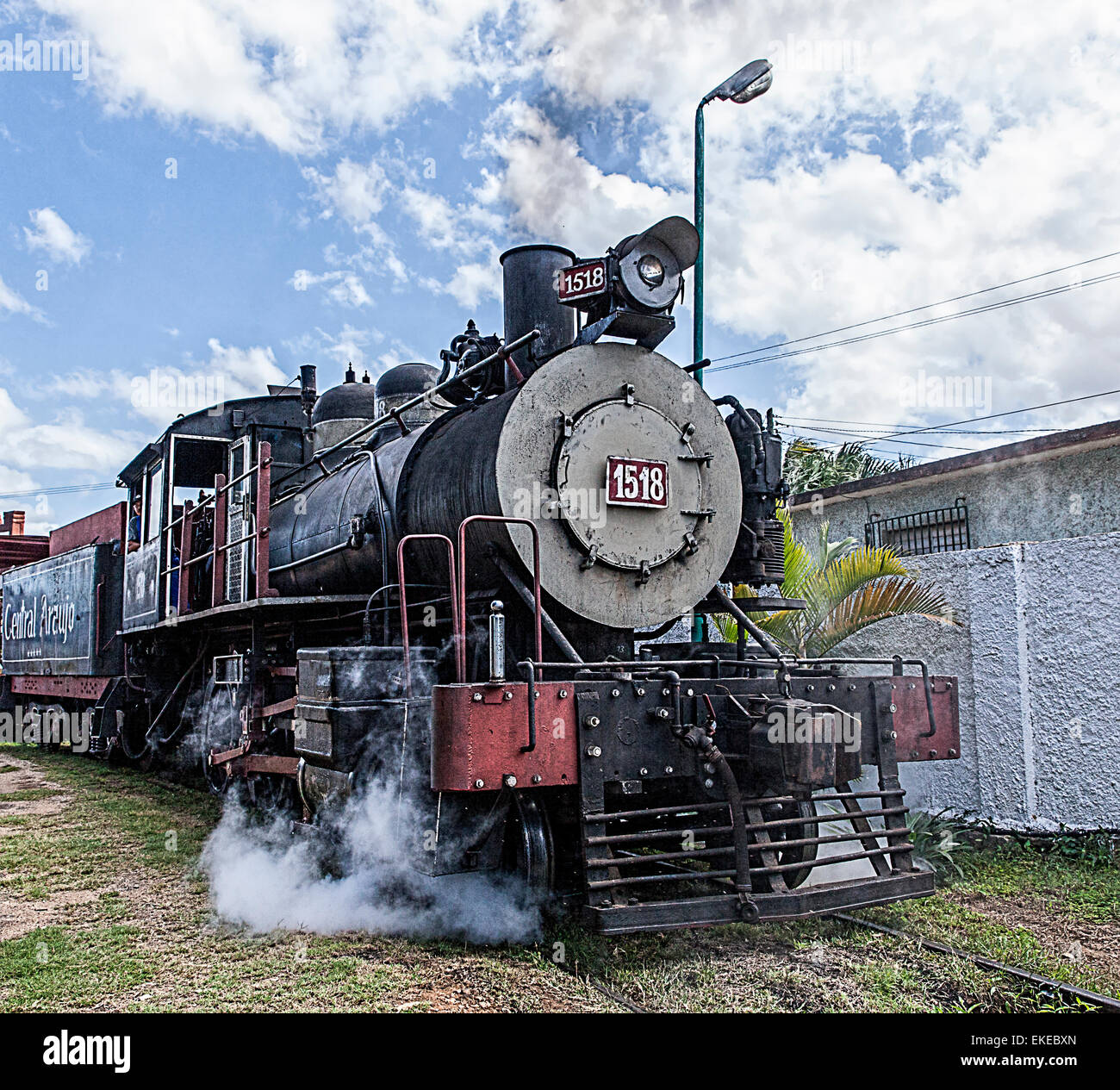 Old American steam train in Cuba with steam coming out of the wheels ...