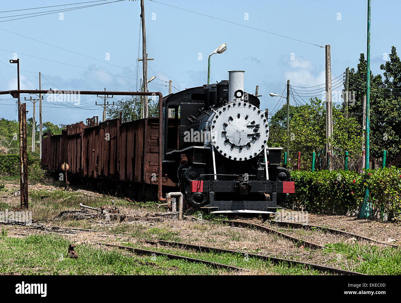 An old restored American steam train pulling freight wagons in Cuba ...