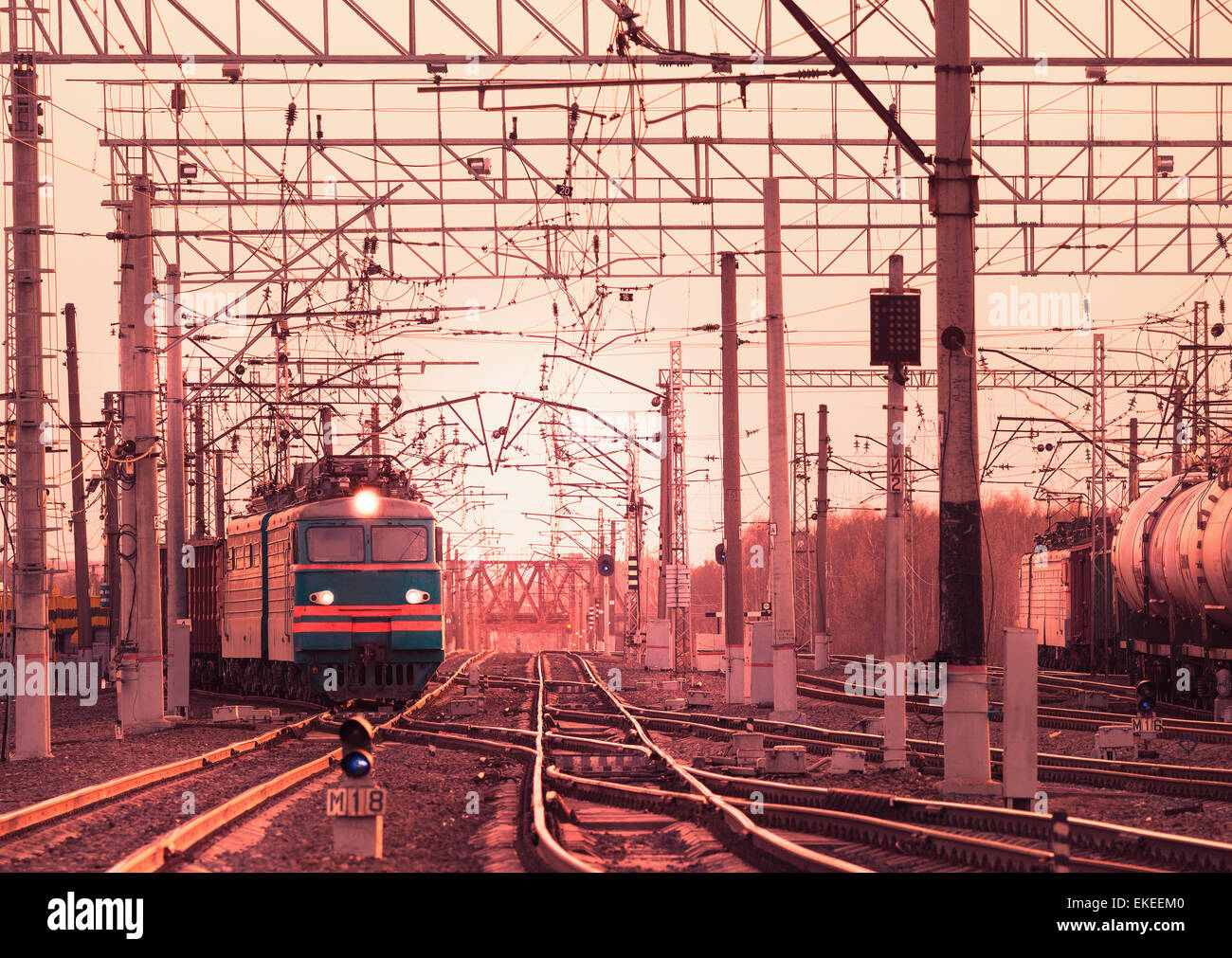 Two long freight trains moves through the station Stock Photo - Alamy