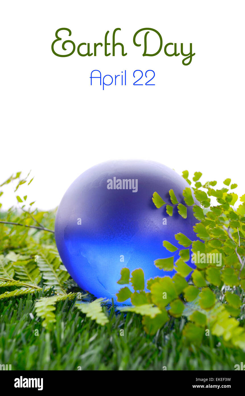 Earth Day, April 22, Concept with blue globe on grass and ferns Stock ...