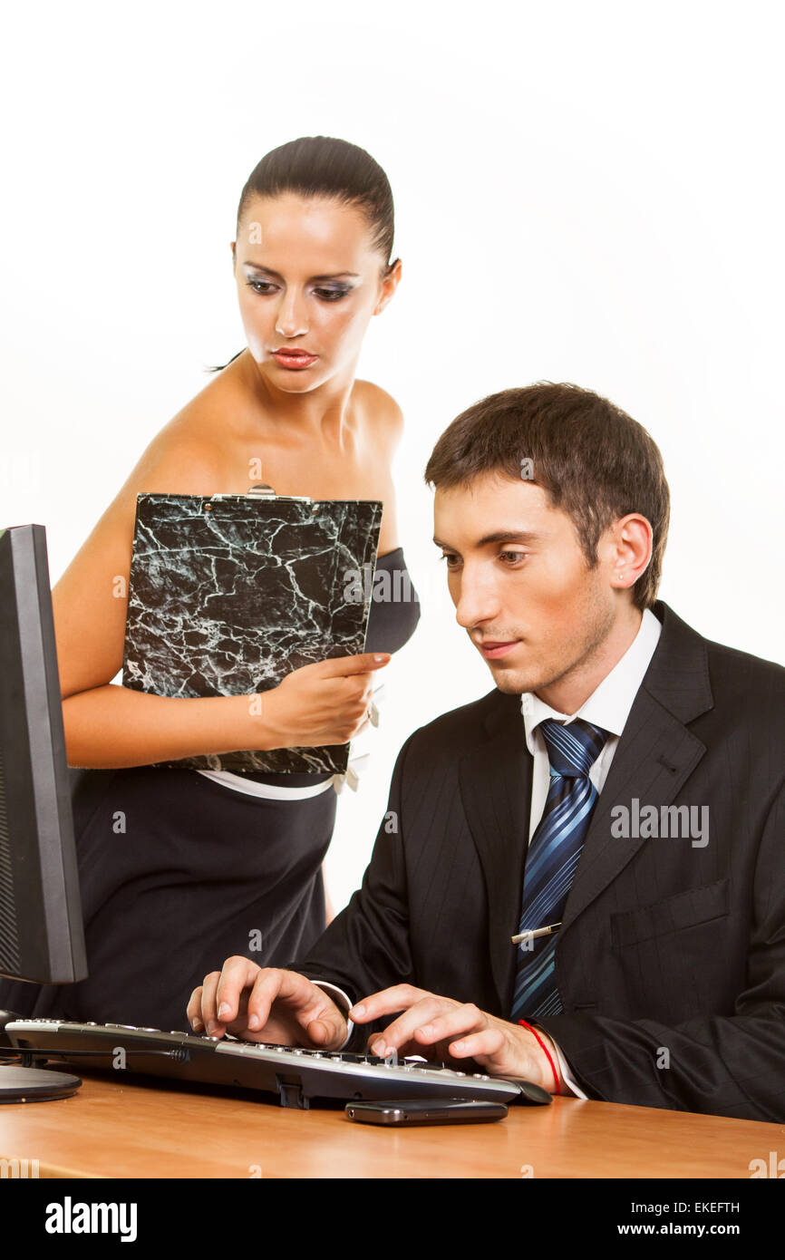 Two contemporary businesspeople discussing while working at the ...