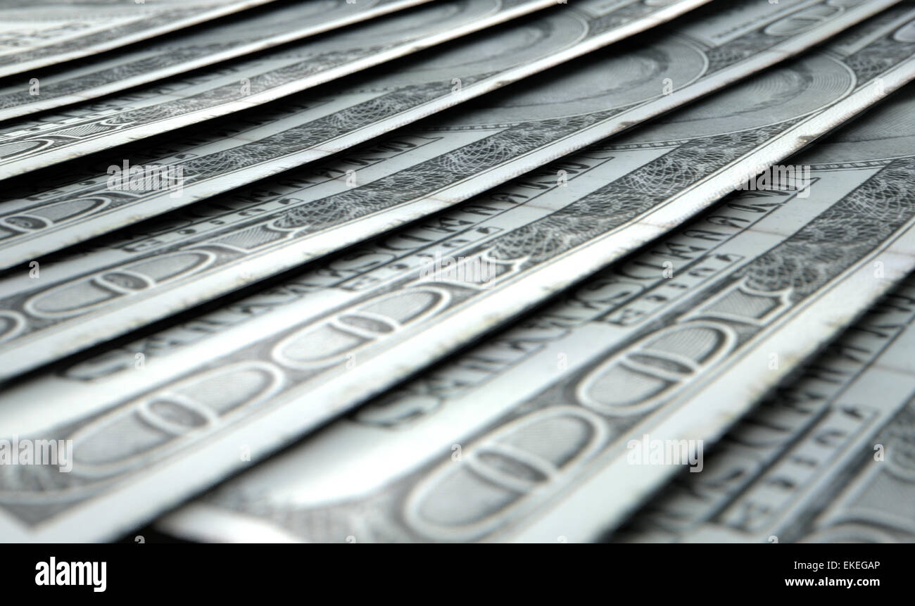 A macro close-up view showing the detail of us dollar banknotes laid ...
