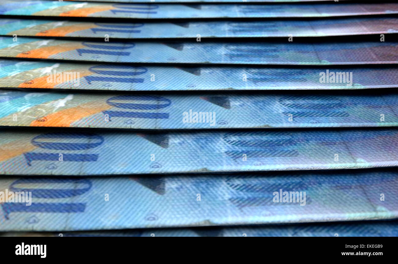 A macro close-up view showing the detail of swiss franc banknotes laid ...