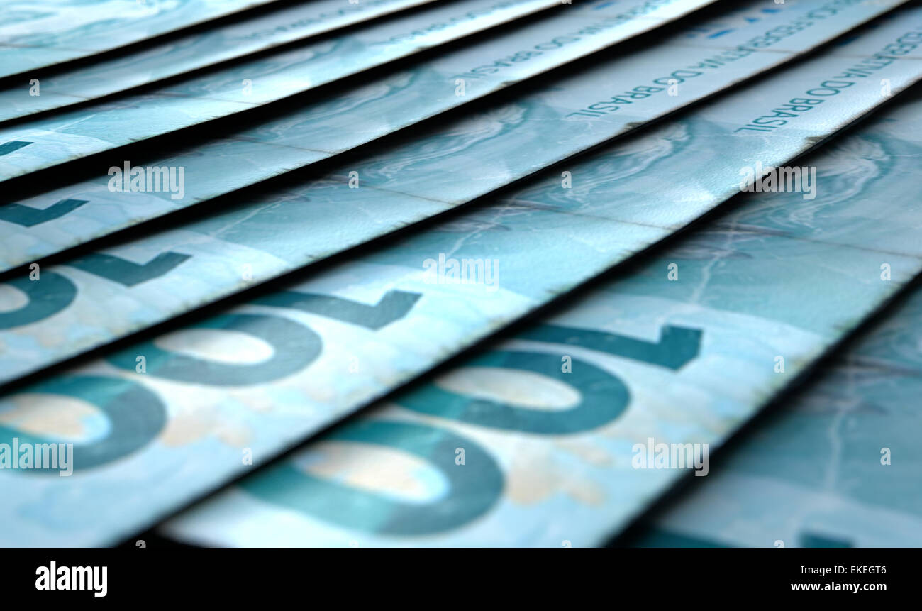 A macro close-up view showing the detail of brazilian real banknotes ...