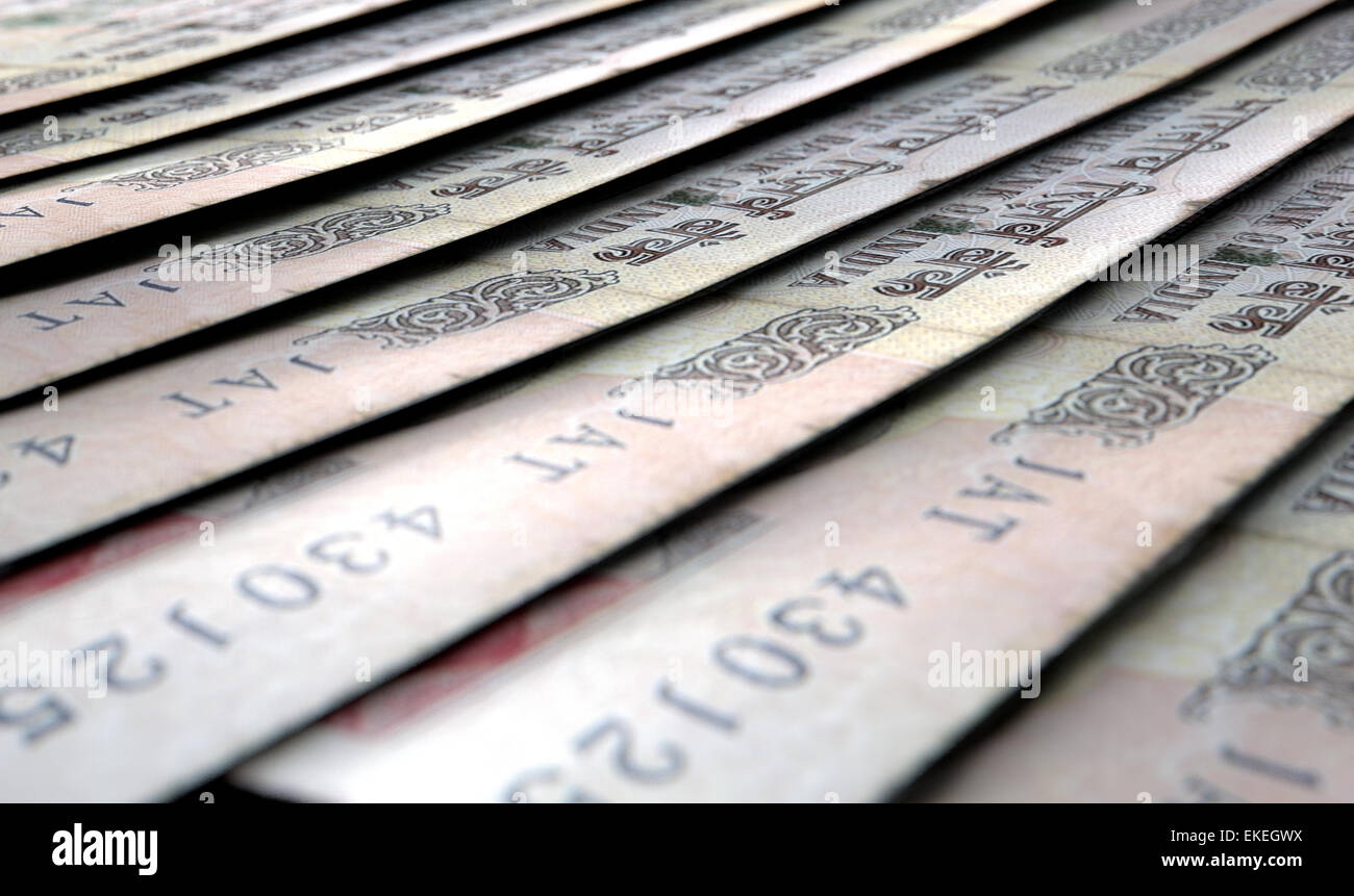 A macro close-up view showing the detail of indian rupee banknotes laid ...