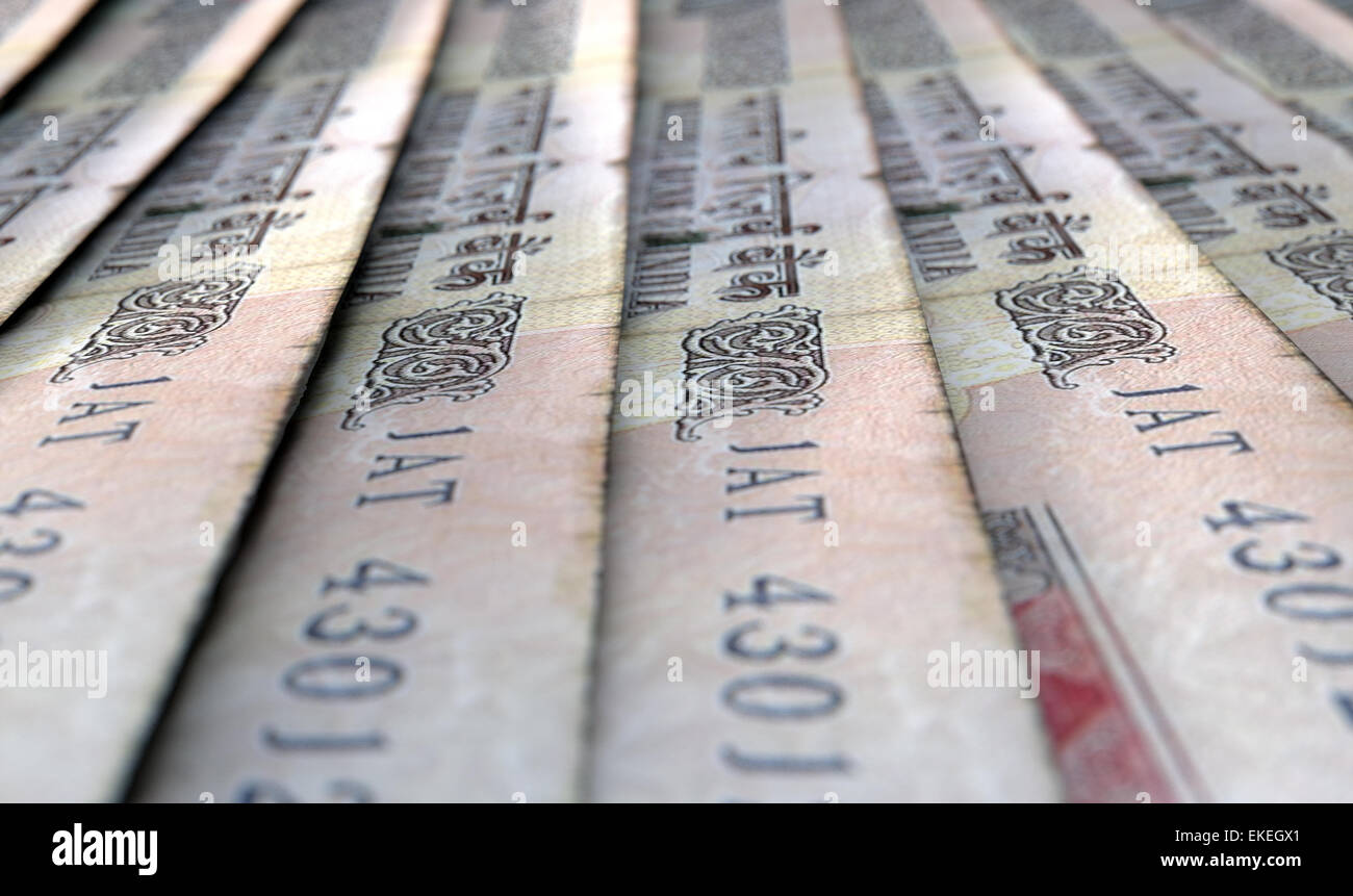 A macro close-up view showing the detail of indian rupee banknotes laid ...