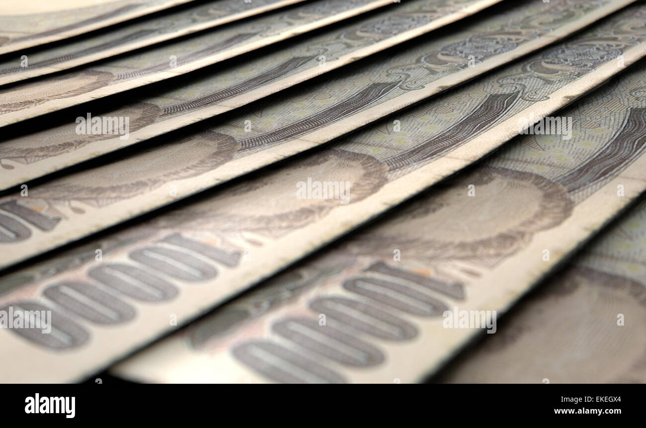 A macro close-up view showing the detail of japanese yen banknotes laid ...