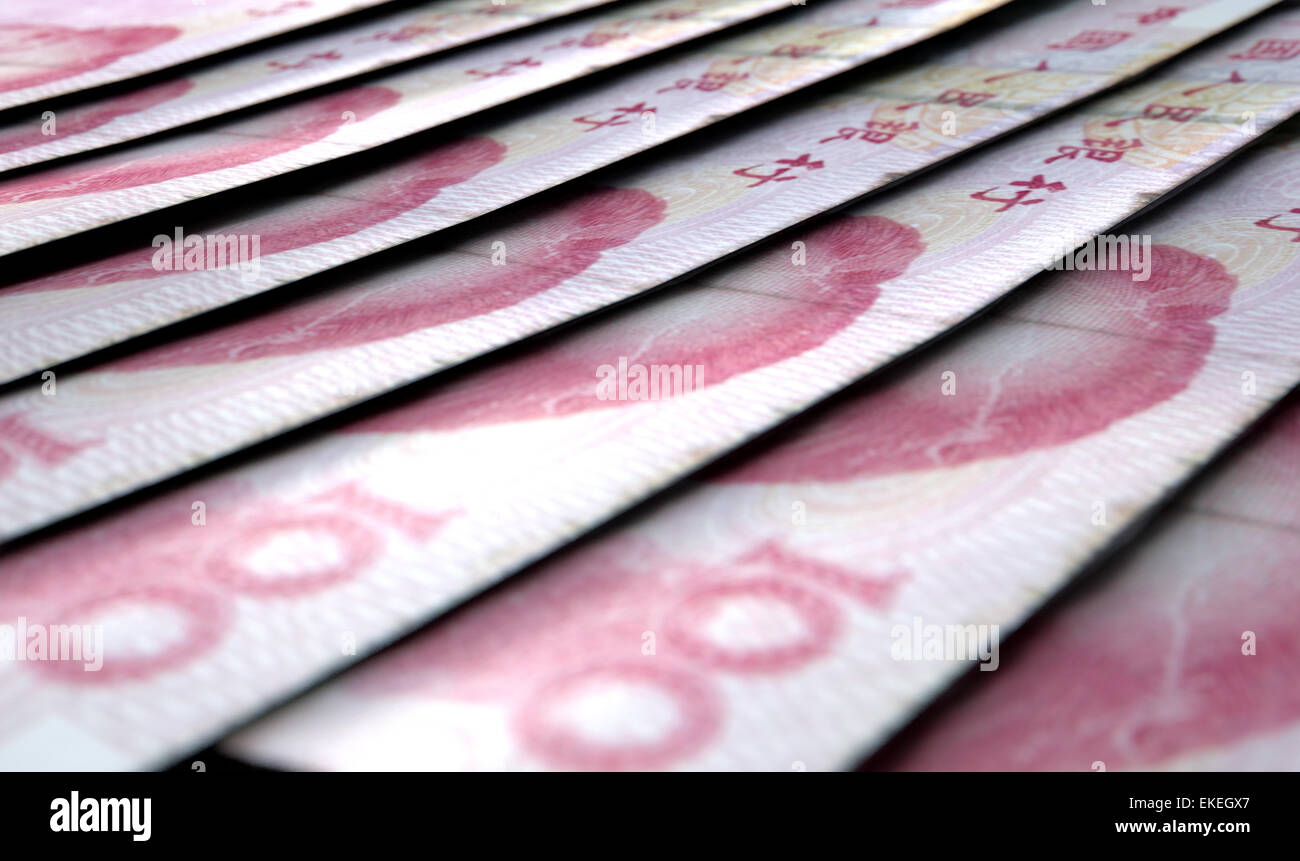 A macro close-up view showing the detail of chinese yuan banknotes laid ...