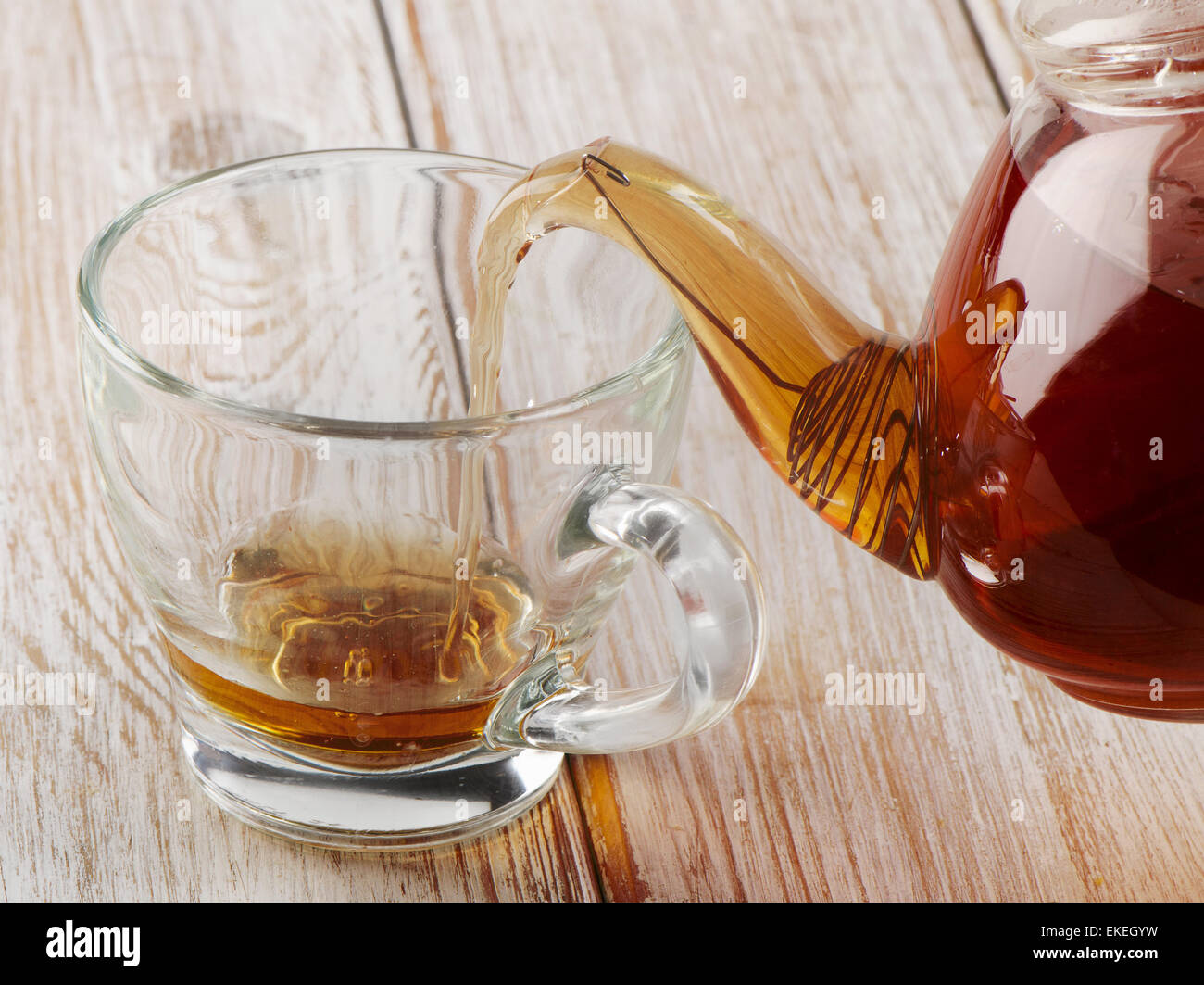 Tea pouring into a glass cup. Selective focus Stock Photo - Alamy