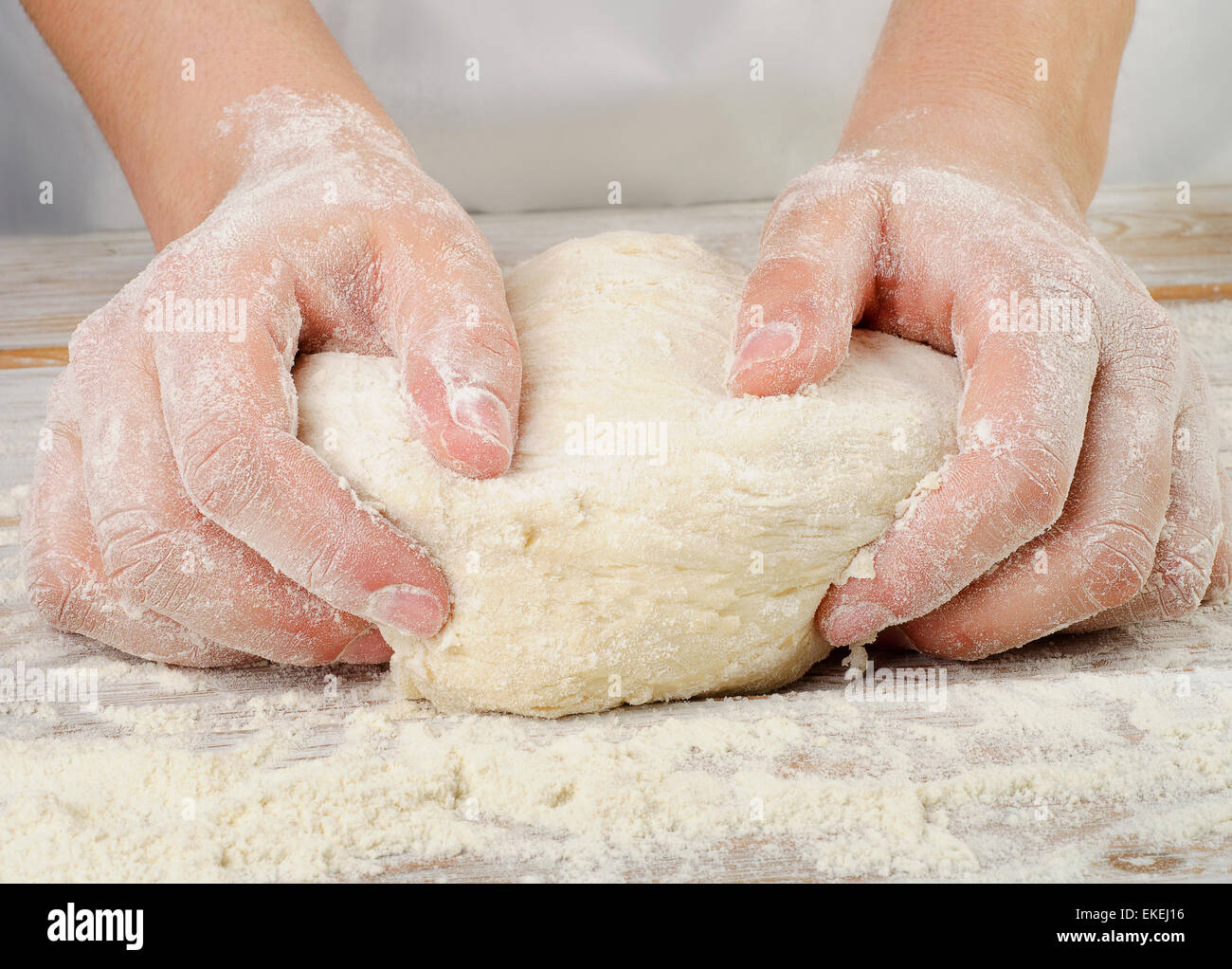 Hands kneading dough in flour hi-res stock photography and images - Alamy
