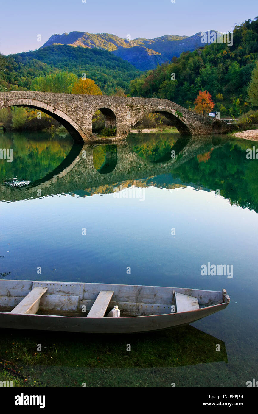 Arched bridge reflected in Crnojevica river, Montenegro, Balkans Stock Photo - Alamy