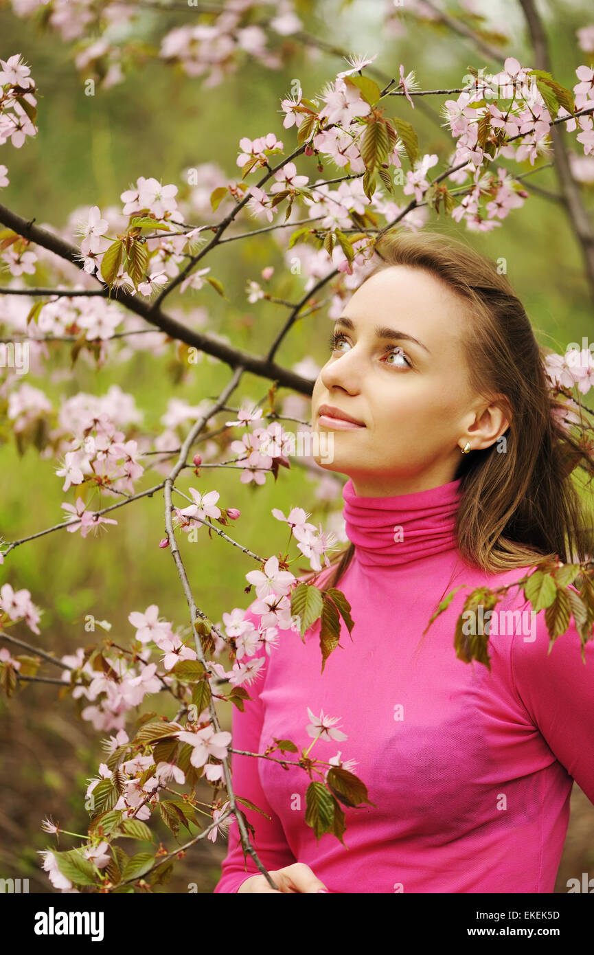 Woman in front of sakura blossoms Stock Photo - Alamy