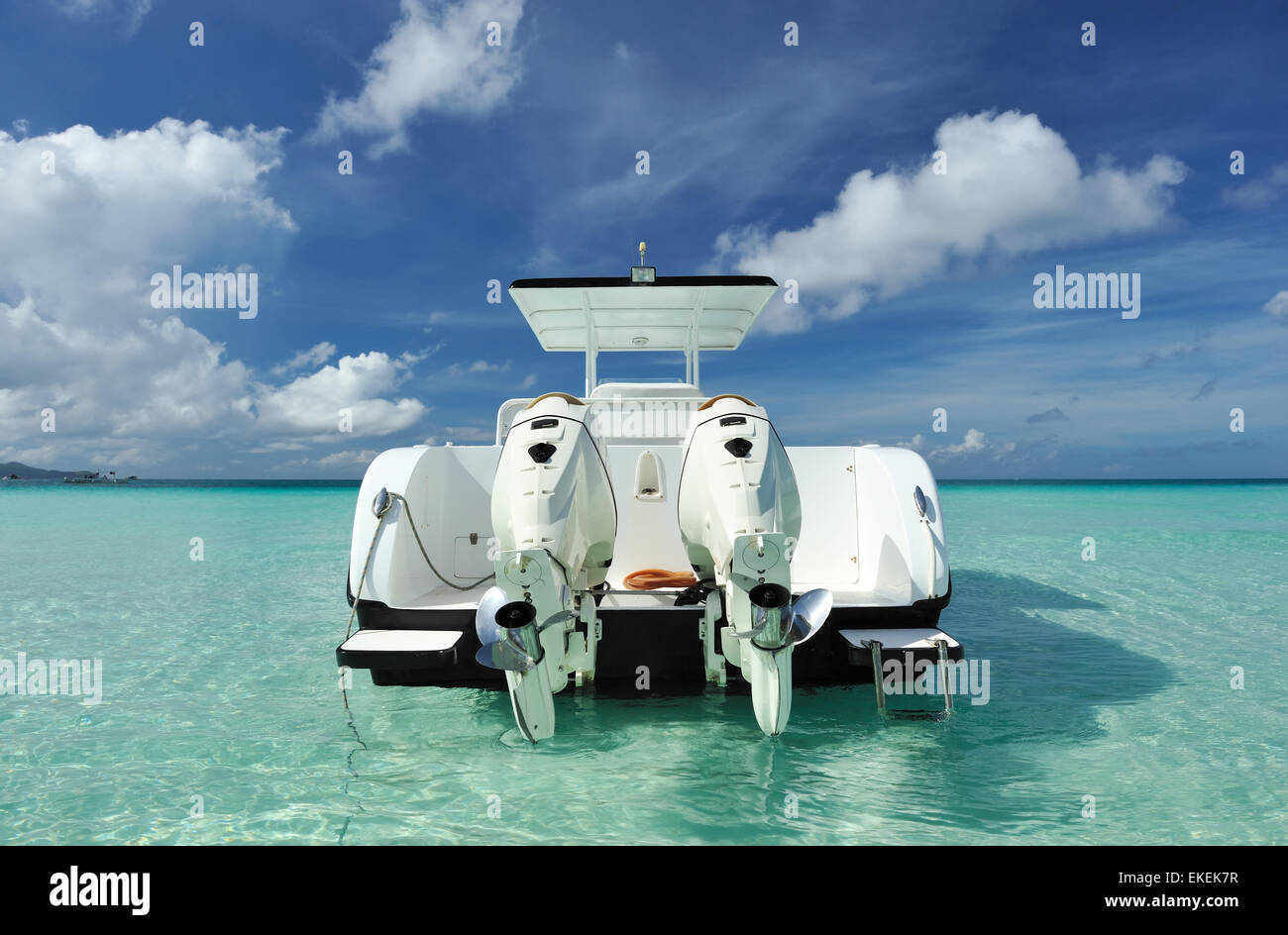 Beautiful beach with motor boat Stock Photo - Alamy