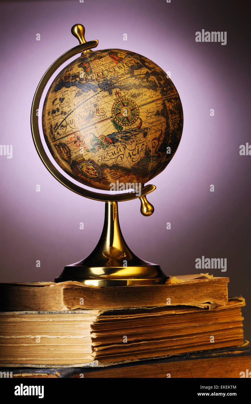 Antique globe on books Stock Photo - Alamy
