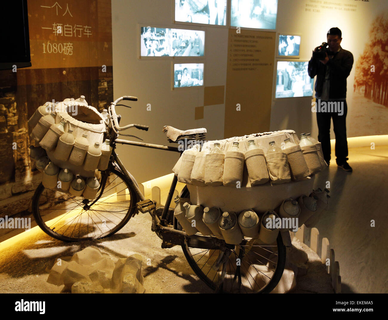 Beijing, China. 9th Apr, 2015. A journalist takes photos of milkman's ...