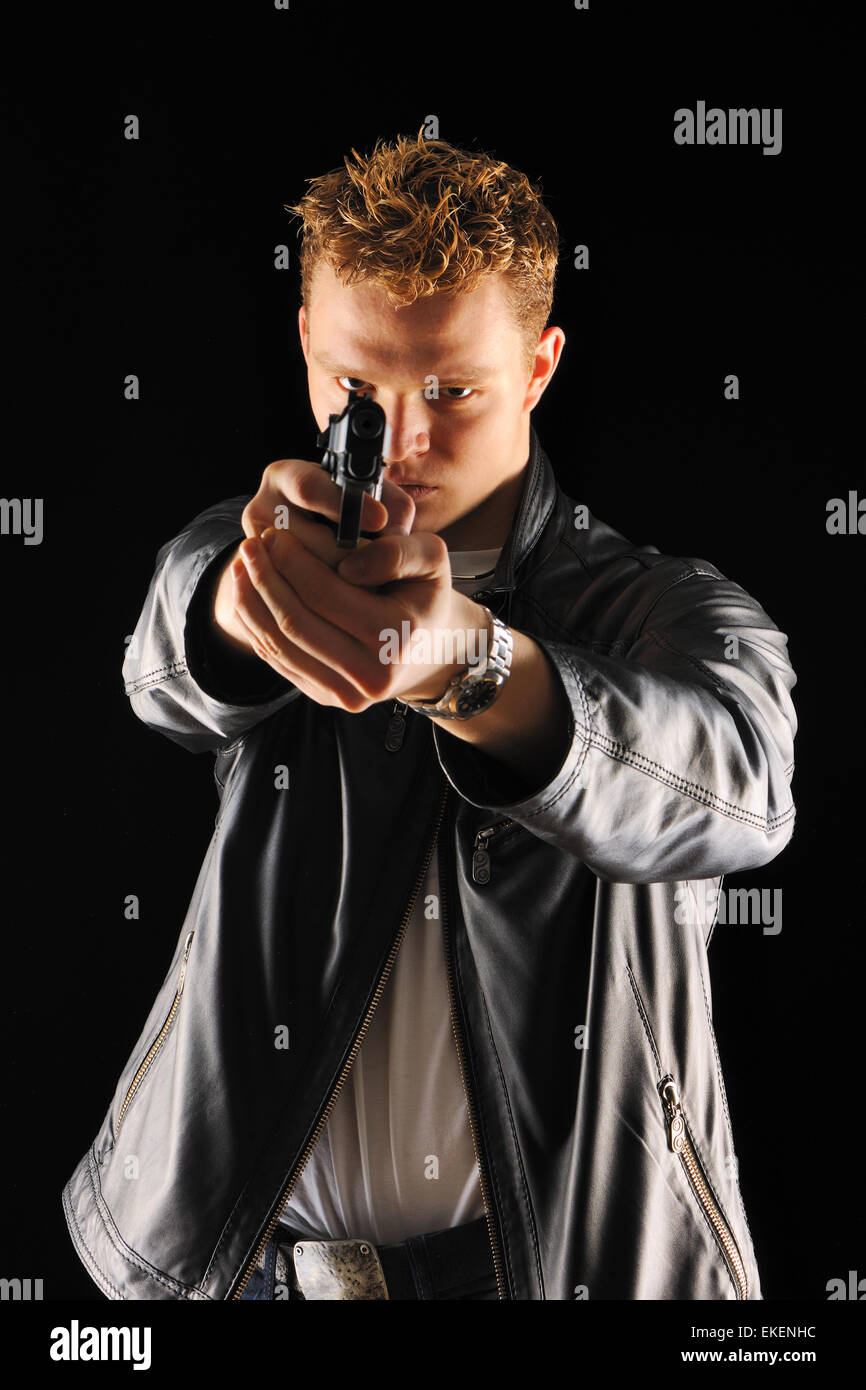 Man with gun Stock Photo - Alamy