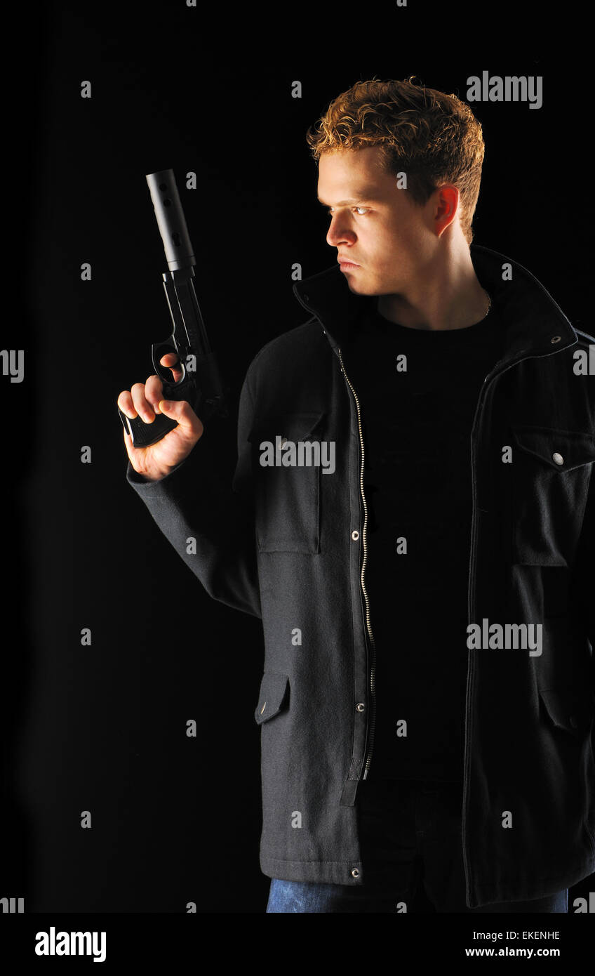 Man with gun Stock Photo - Alamy