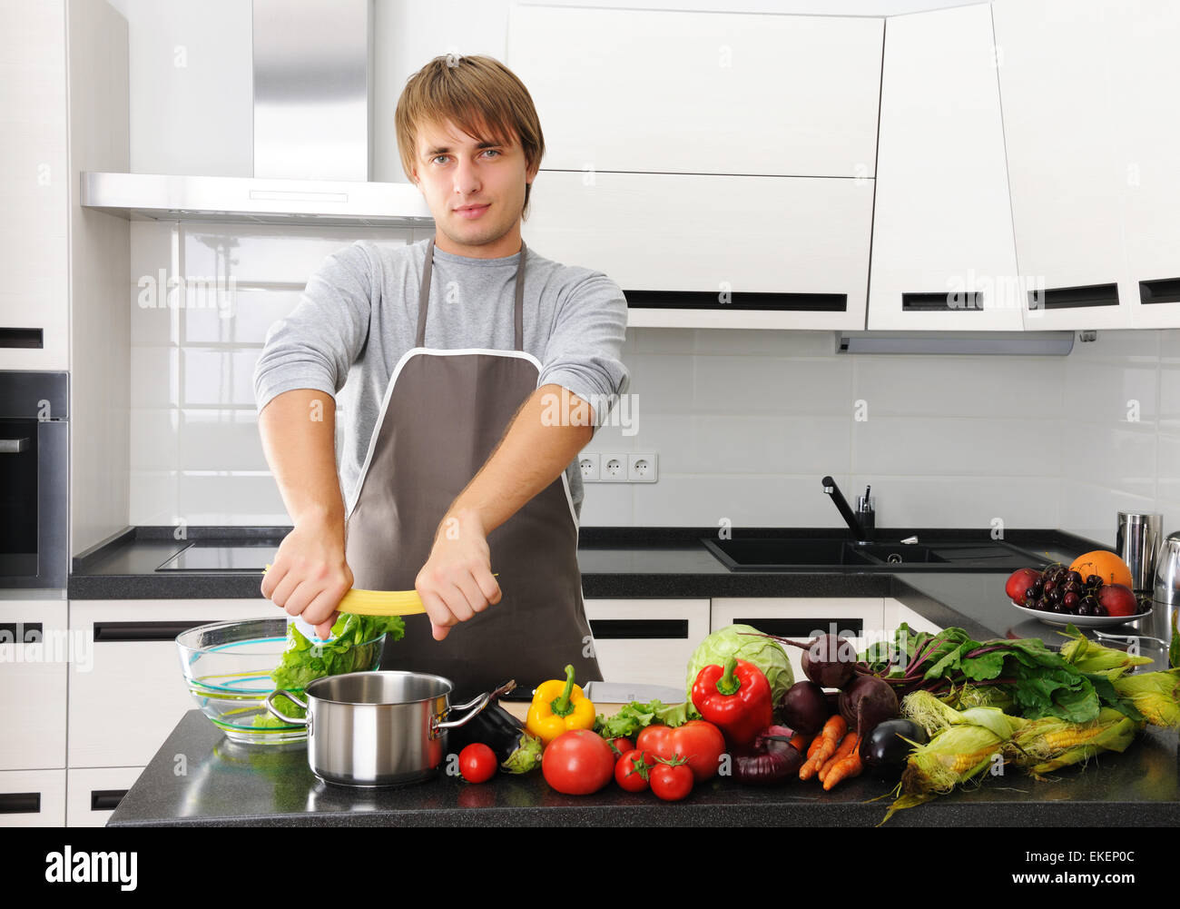 Man in kitchen Stock Photo - Alamy