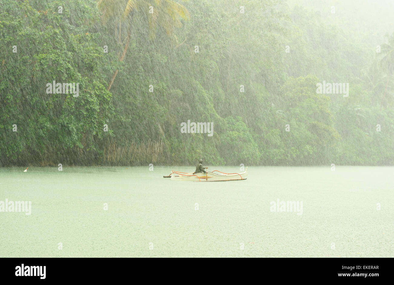 Tropical rain above river Stock Photo - Alamy