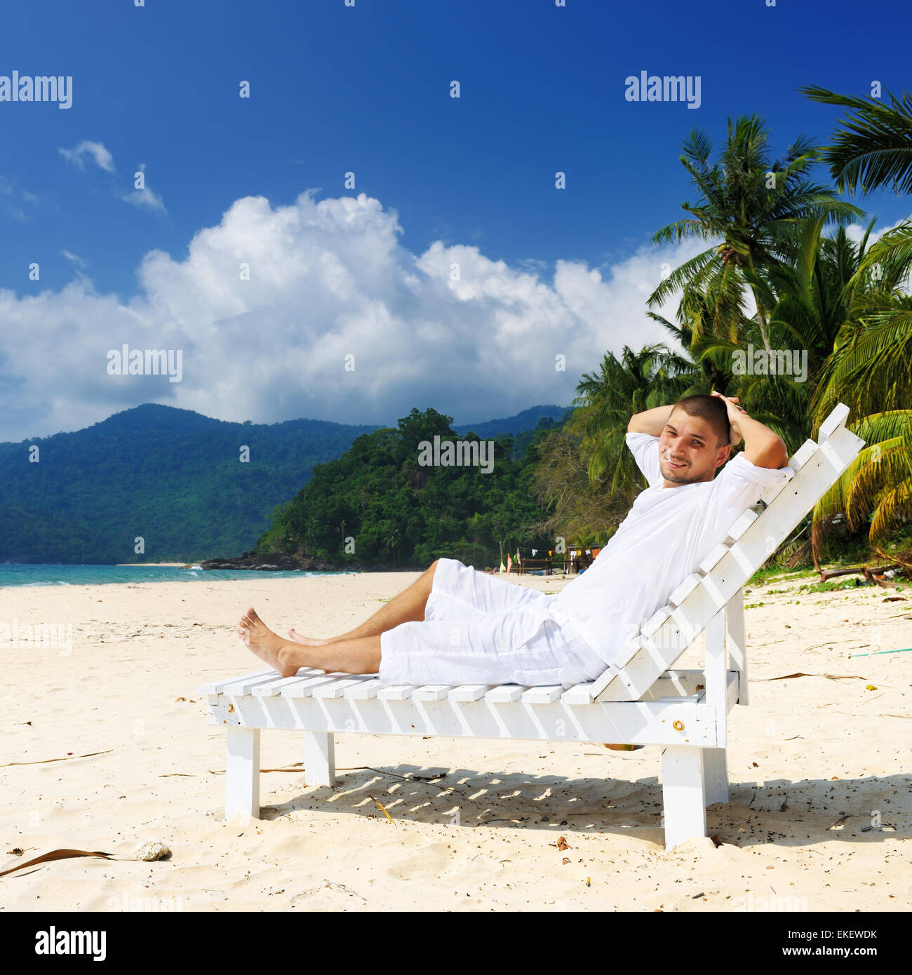 Man relaxing on a beach Stock Photo - Alamy