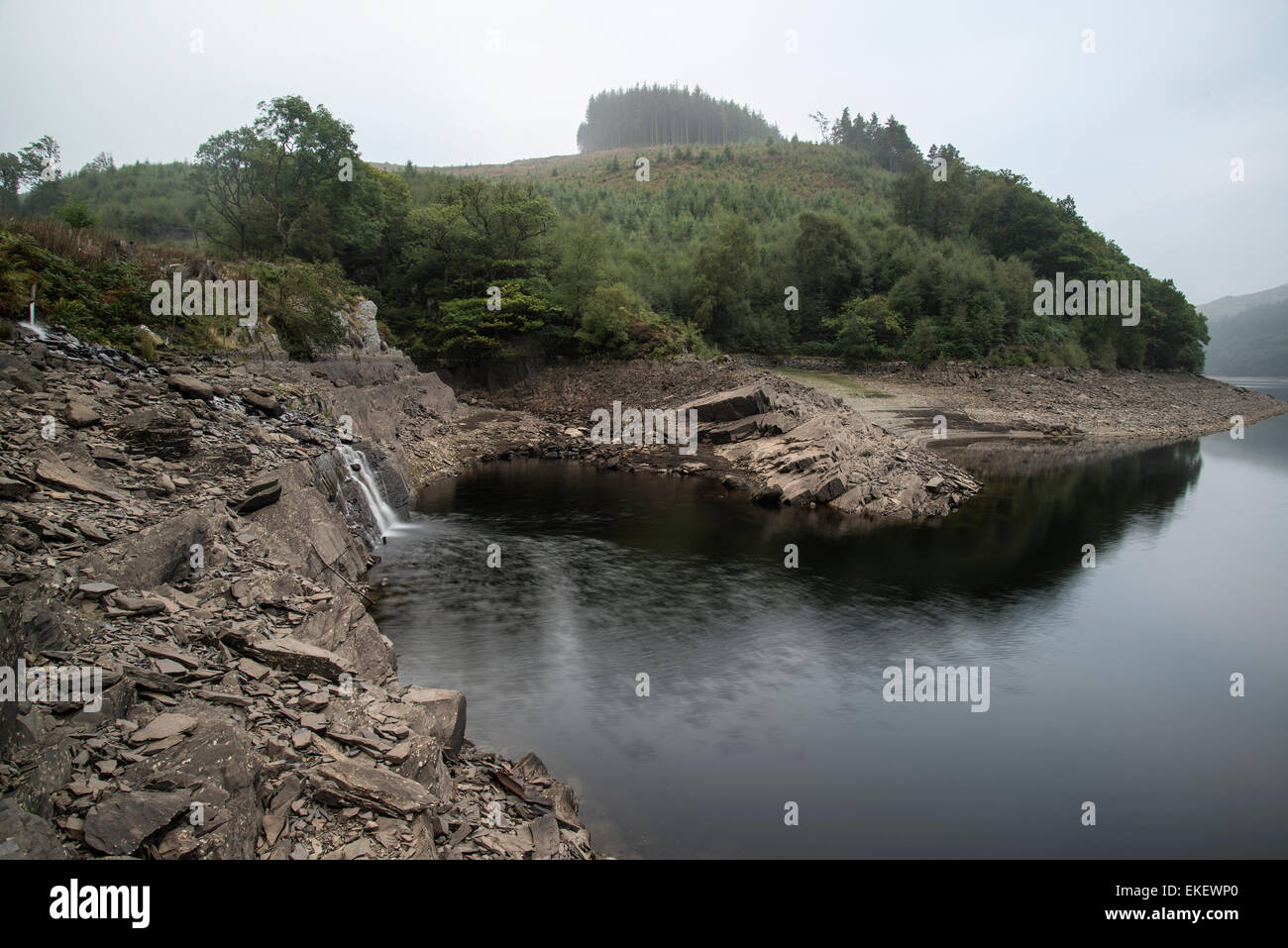 Landscape image of waterfall flowing into old abandoned quarry Stock ...