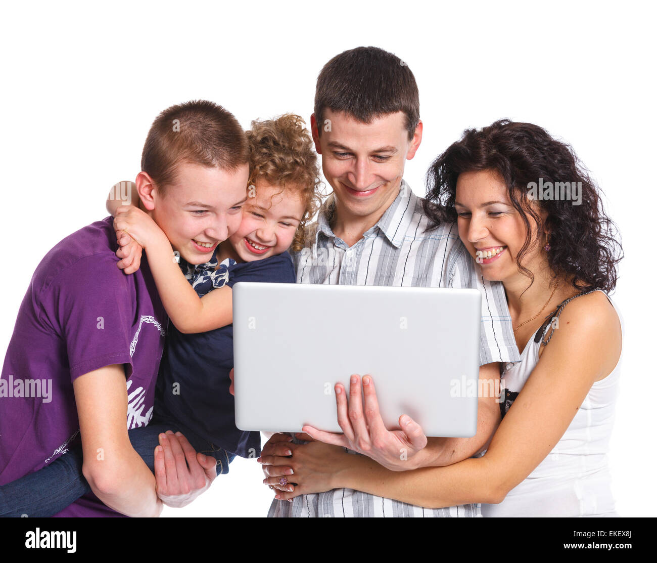 Young parents, with children, on laptop computer Stock Photo - Alamy