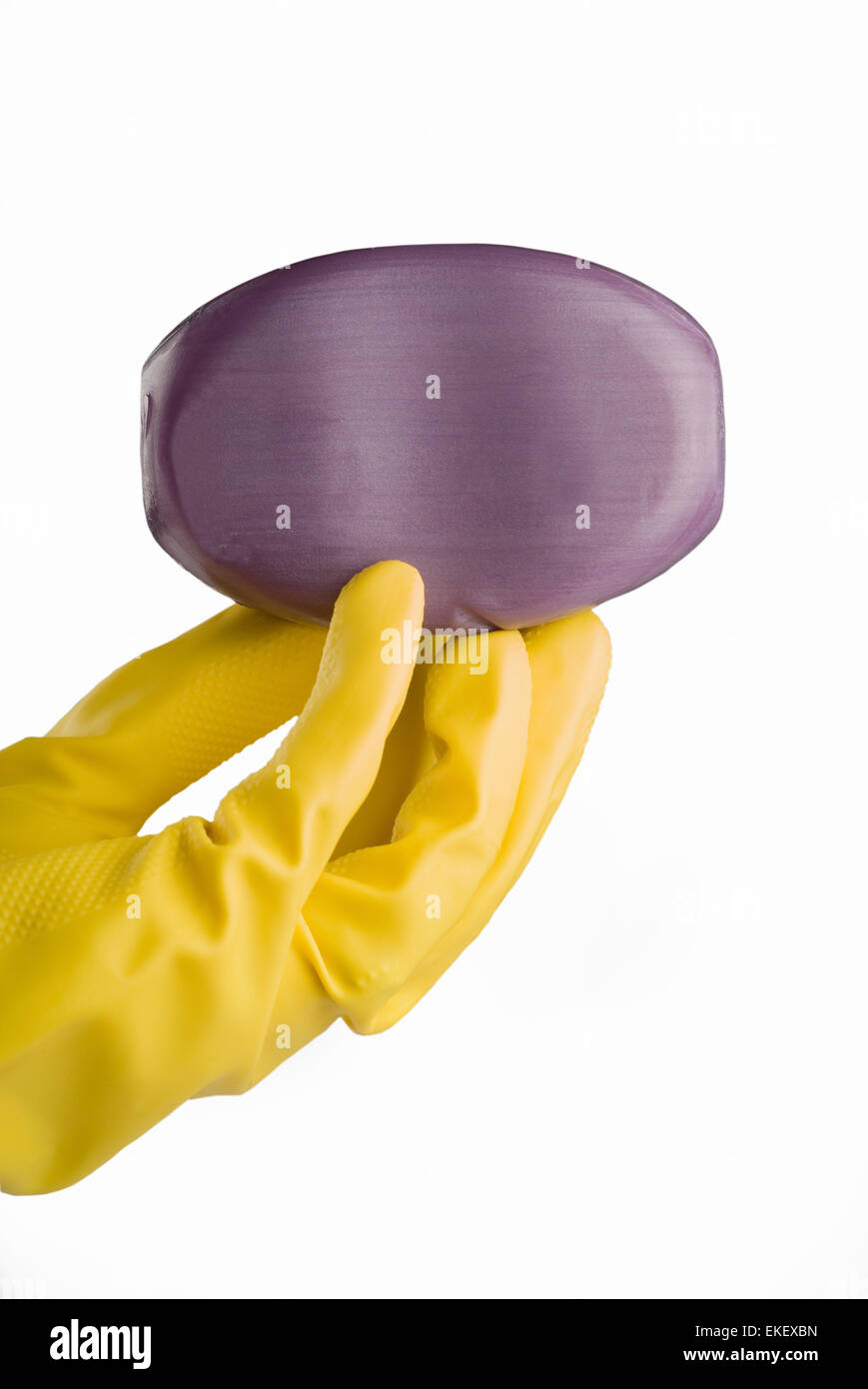 Yellow gloves and soap Stock Photo - Alamy