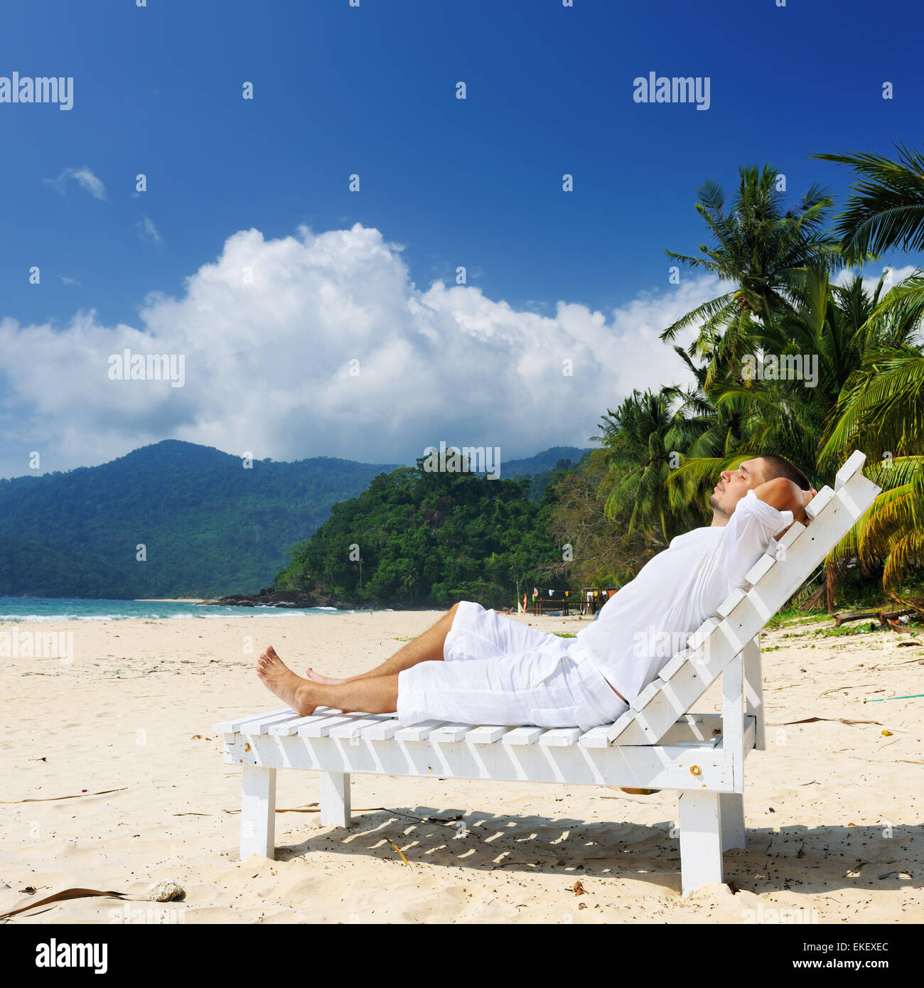 Man relaxing on a beach Stock Photo - Alamy