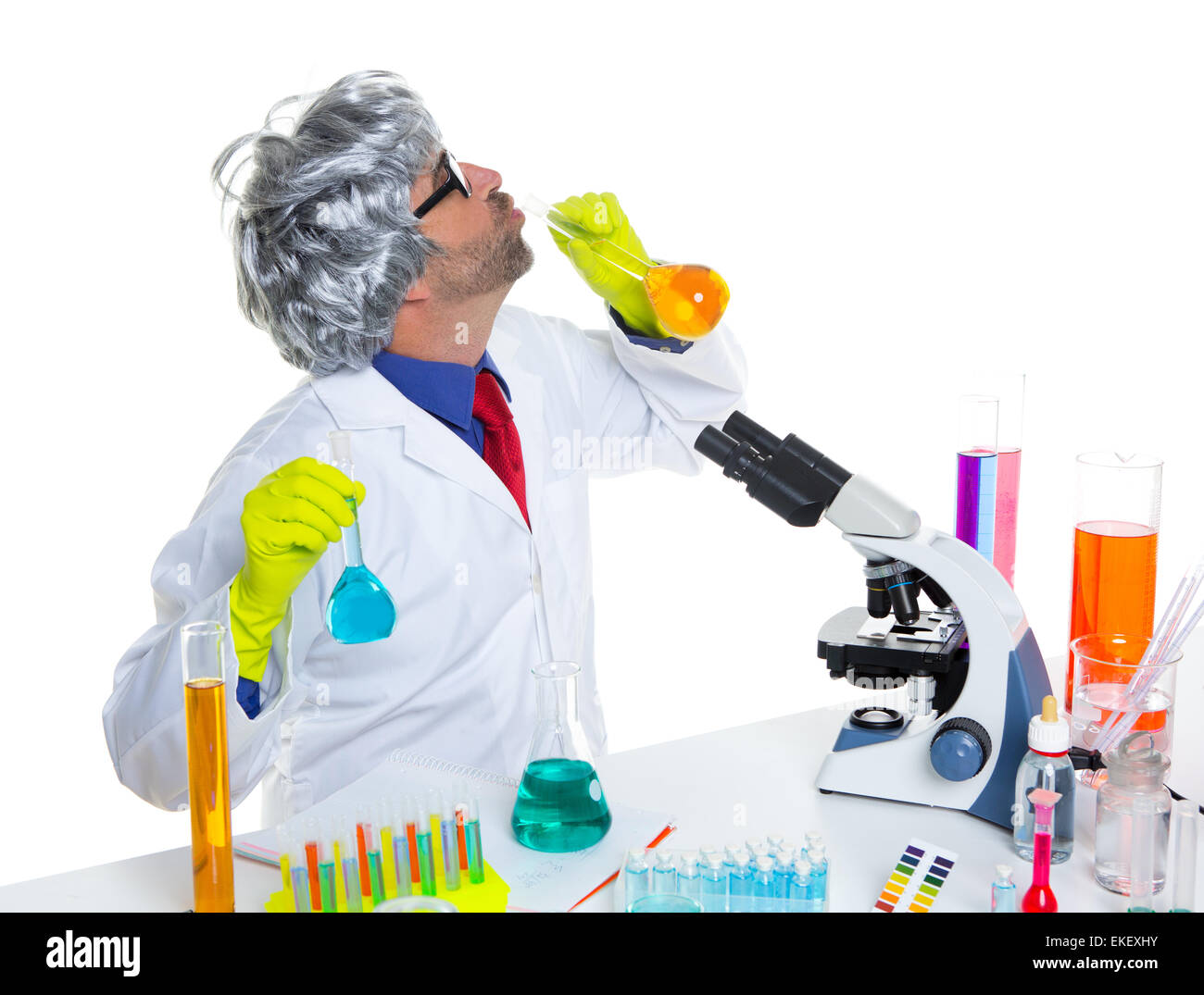 Crazy silly nerd scientist drinking chemical experiment Stock Photo - Alamy