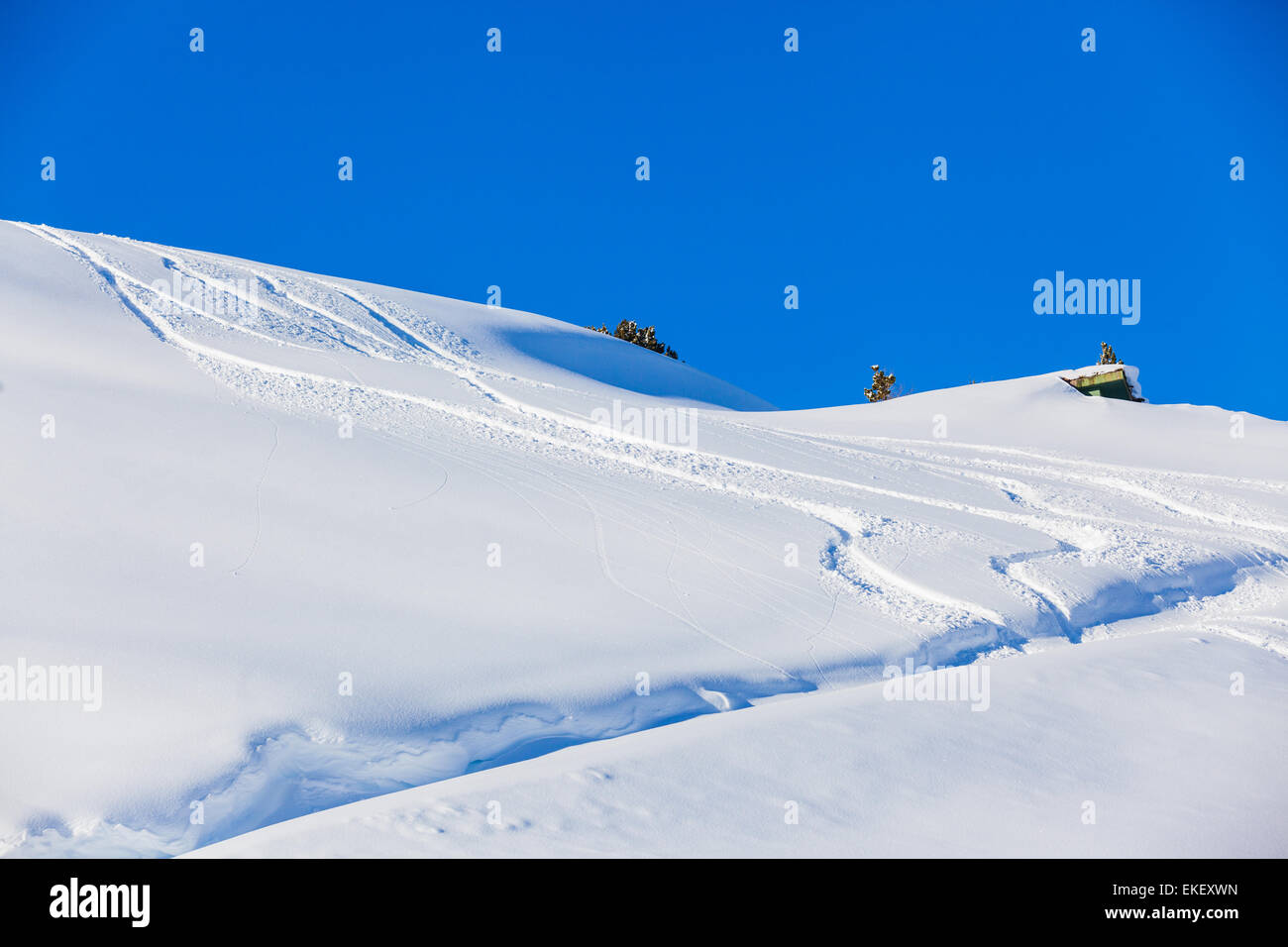 Snow background with ski and snowboard tracks Stock Photo - Alamy