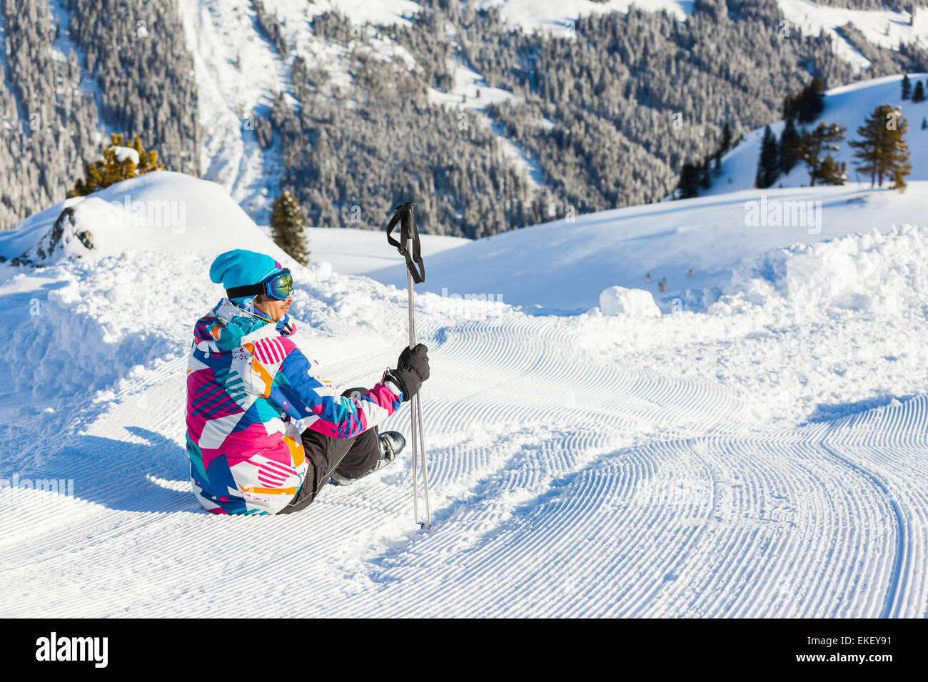 Man sitting on top of Alps, resting after skiing Stock Photo - Alamy