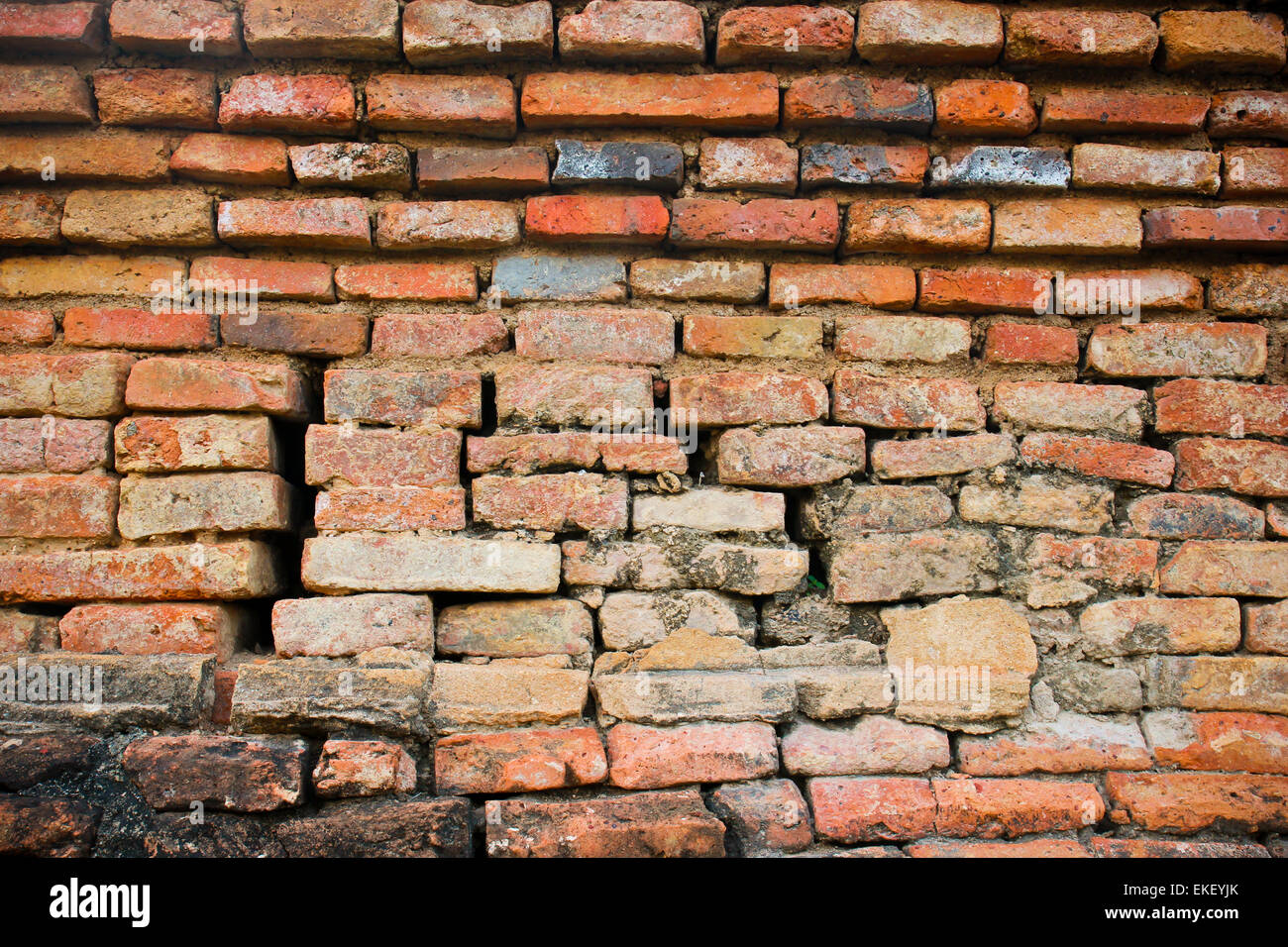 Destroyed brick wall for background Stock Photo - Alamy