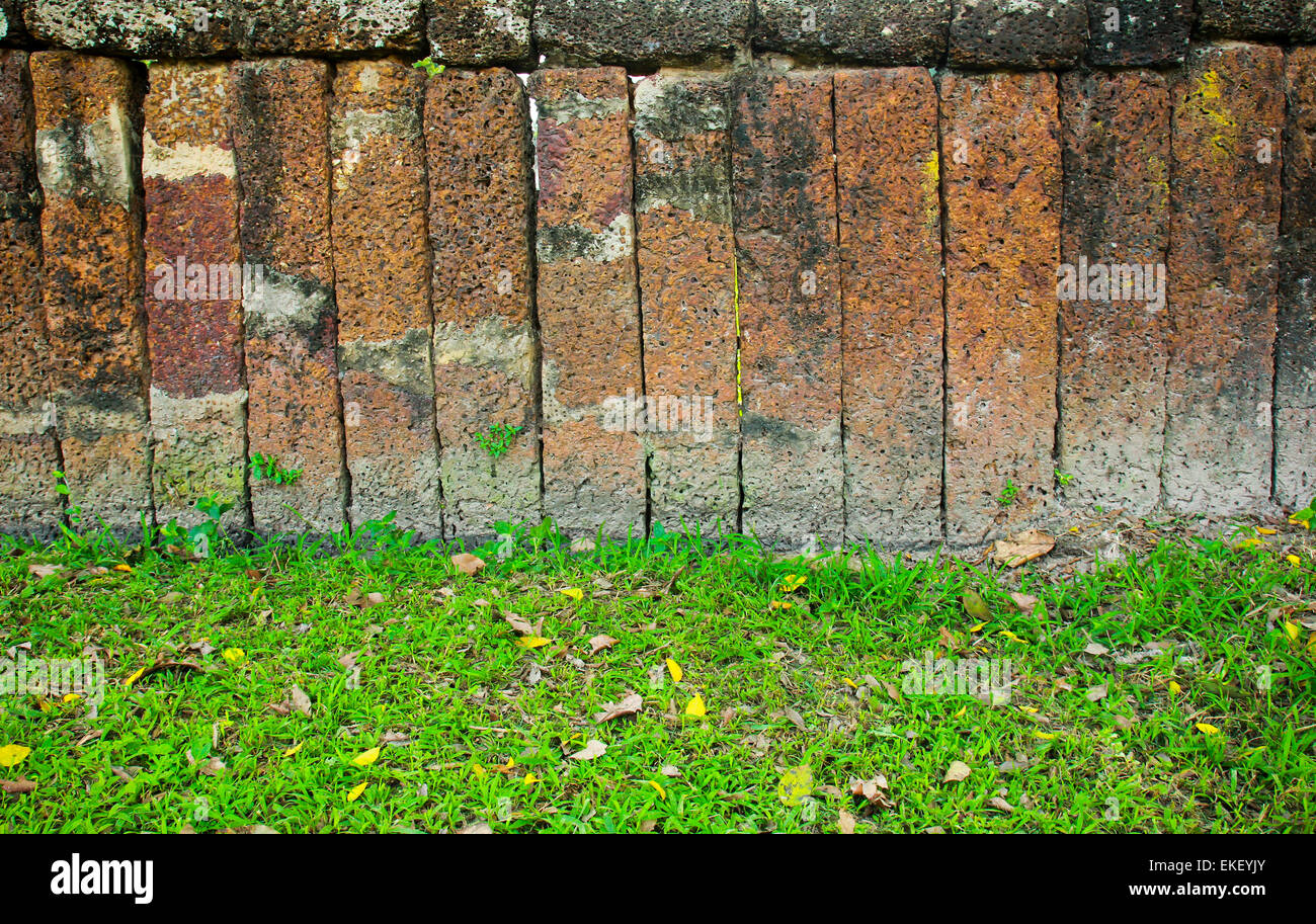 Stone block wall with green grass Stock Photo - Alamy