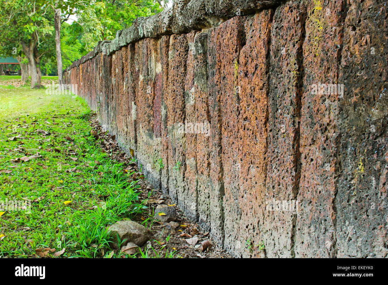 Stone block wall with green grass Stock Photo - Alamy
