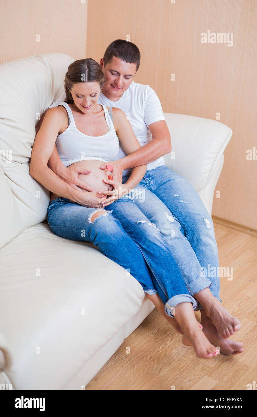 Portrait of young pair pending the kid Stock Photo - Alamy