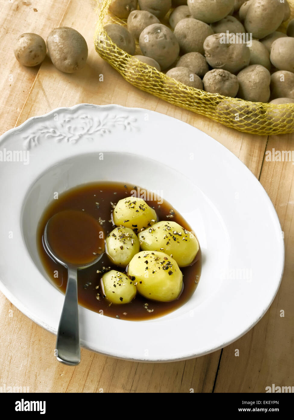boiled potatoes in brown sauce Stock Photo - Alamy