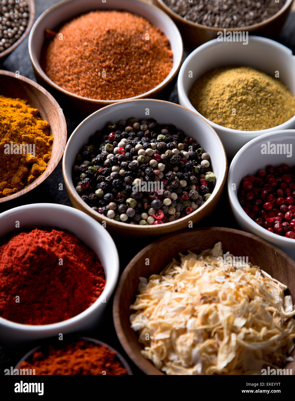 Assorted spices on wooden background Stock Photo - Alamy
