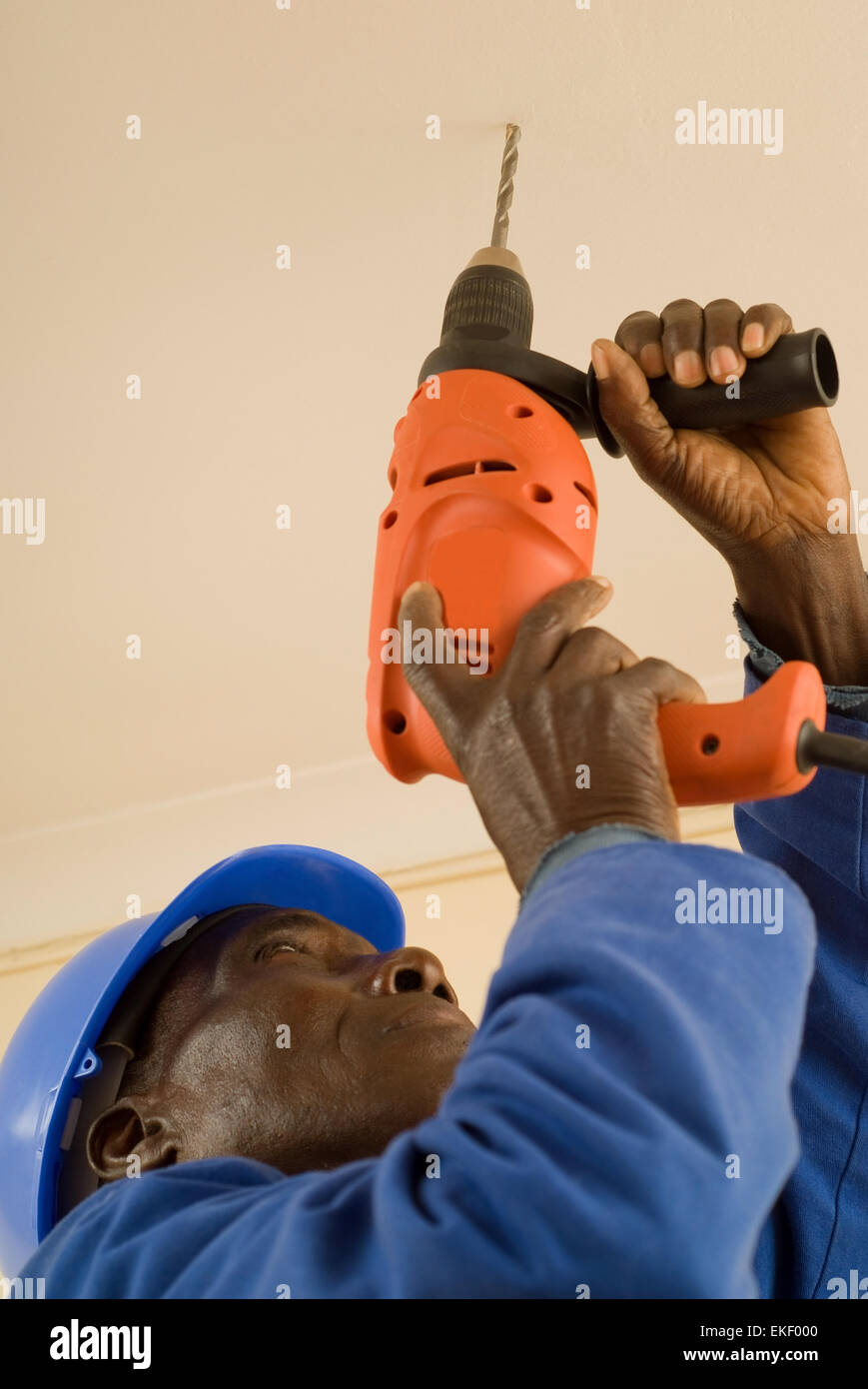Construction Worker Working with Power Tool Stock Photo - Alamy