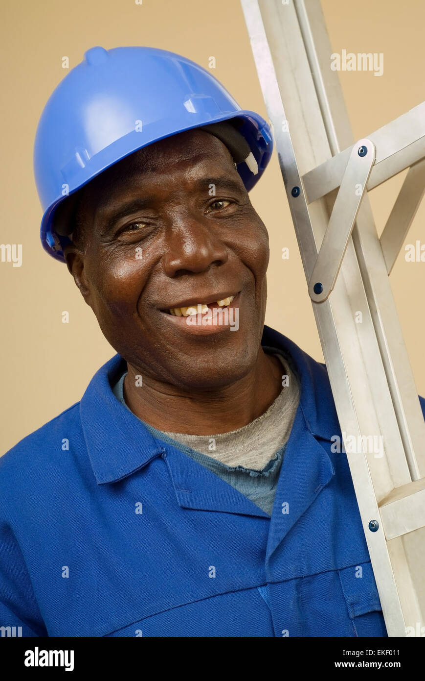 Construction Worker Carrying Ladder Stock Photo - Alamy