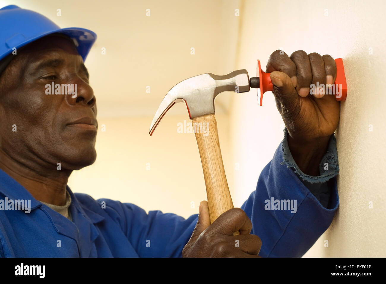 Construction Worker Holding Hammer Stock Photo - Alamy