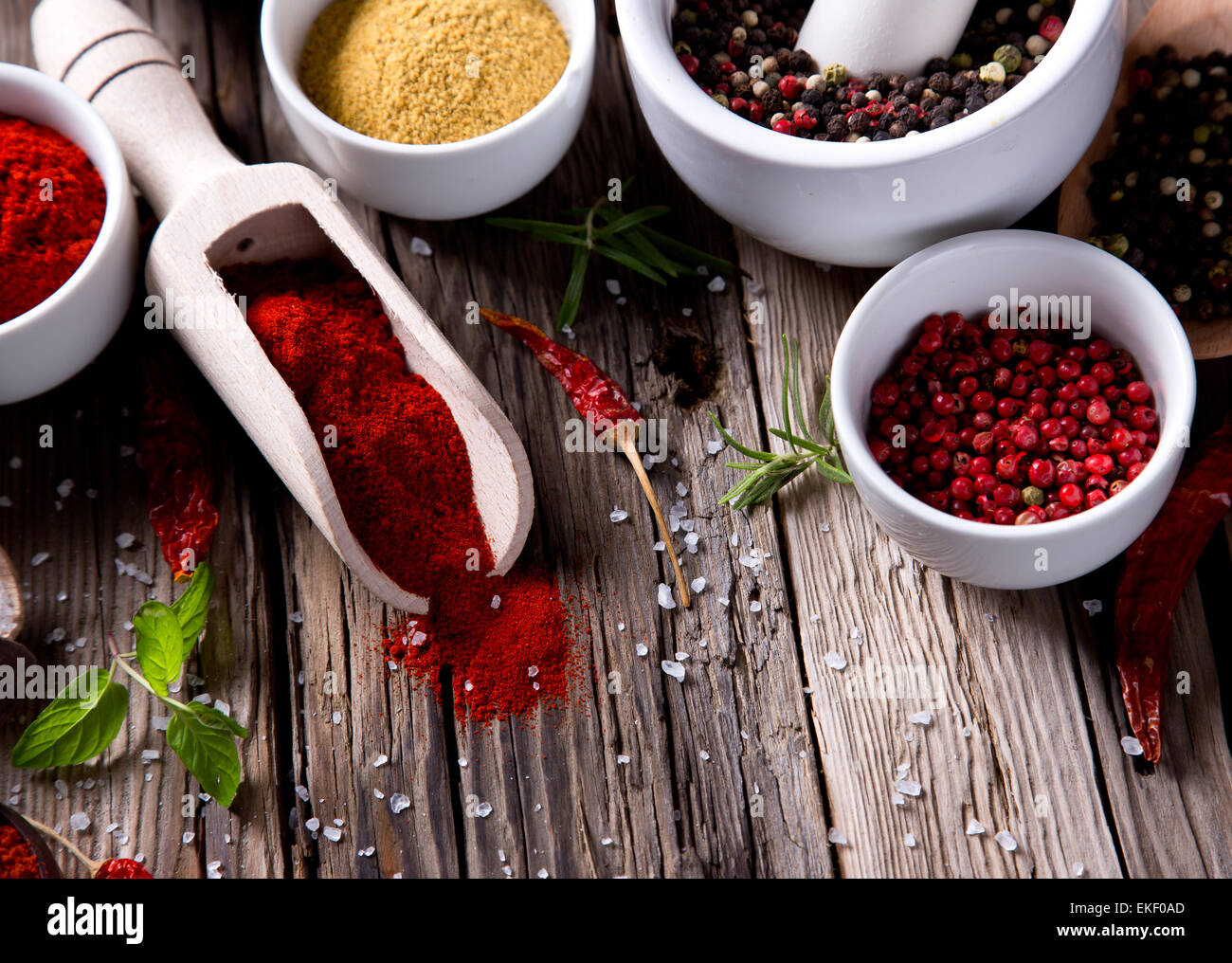 Assorted spices on wooden background Stock Photo - Alamy