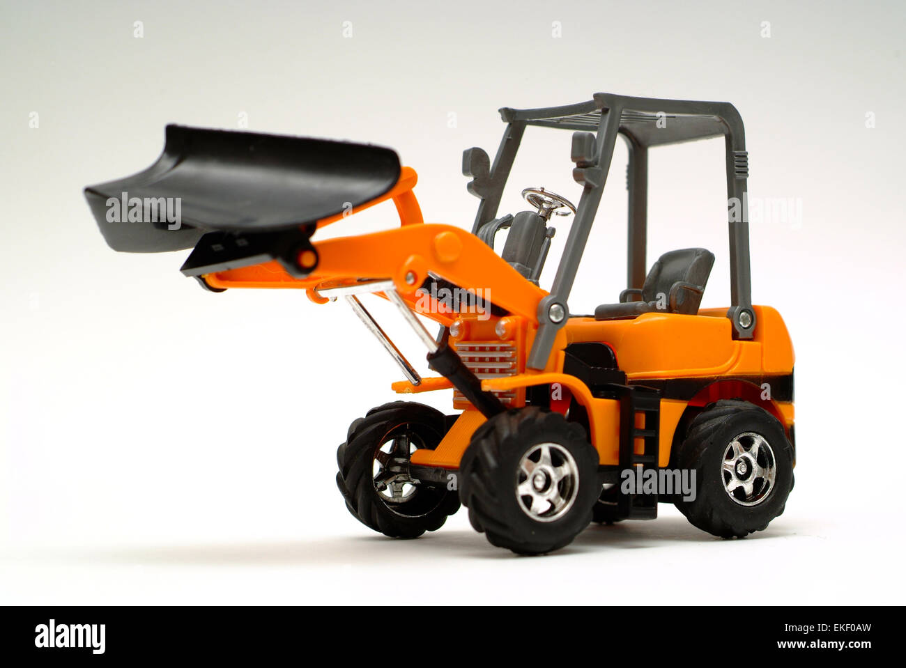 Toy mechanical digger hi-res stock photography and images - Alamy